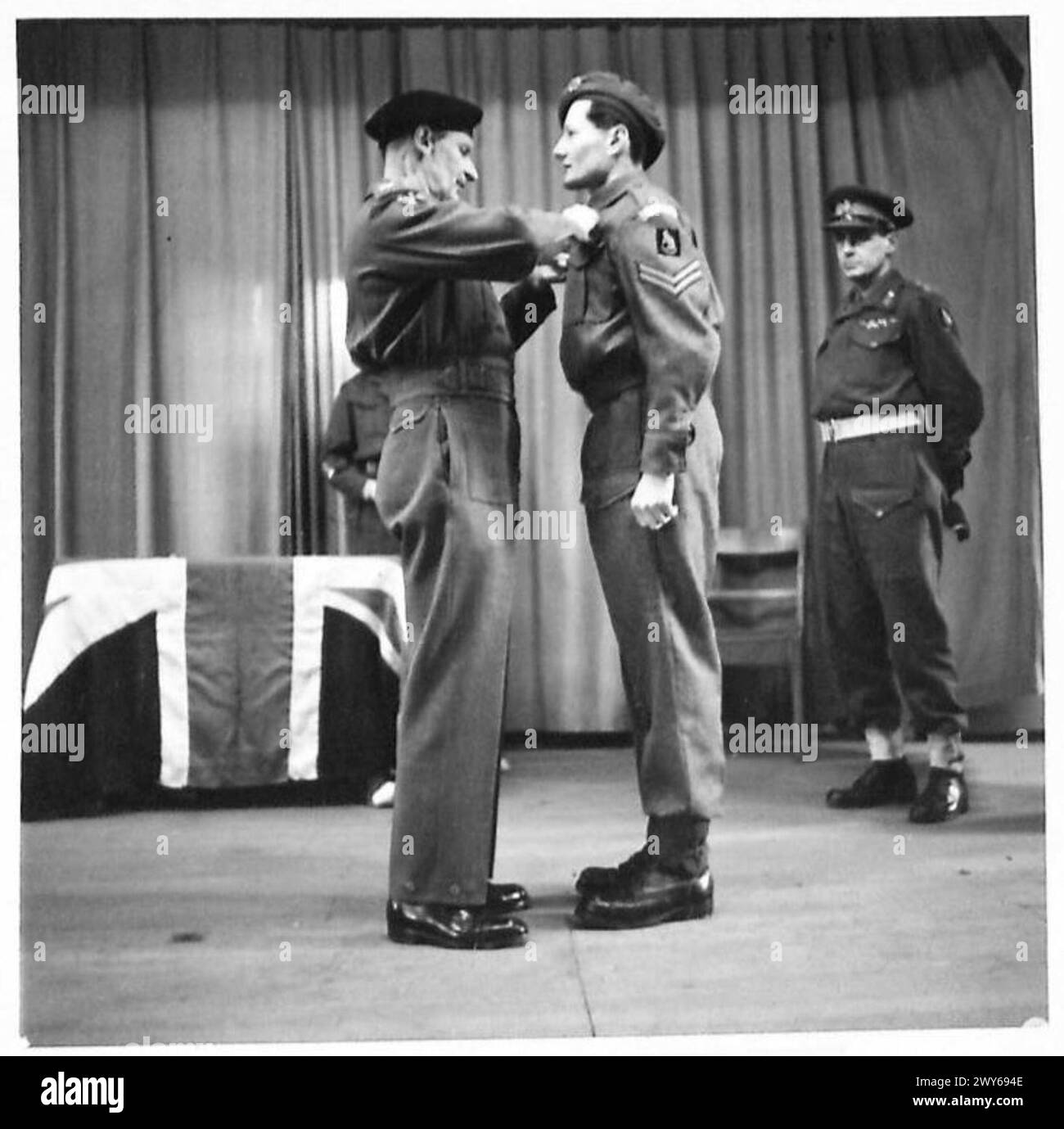 INVESTITURE BY FIELD MARSHAL MONTGOMERY - Cpl Willmot 2 Devon receives ...