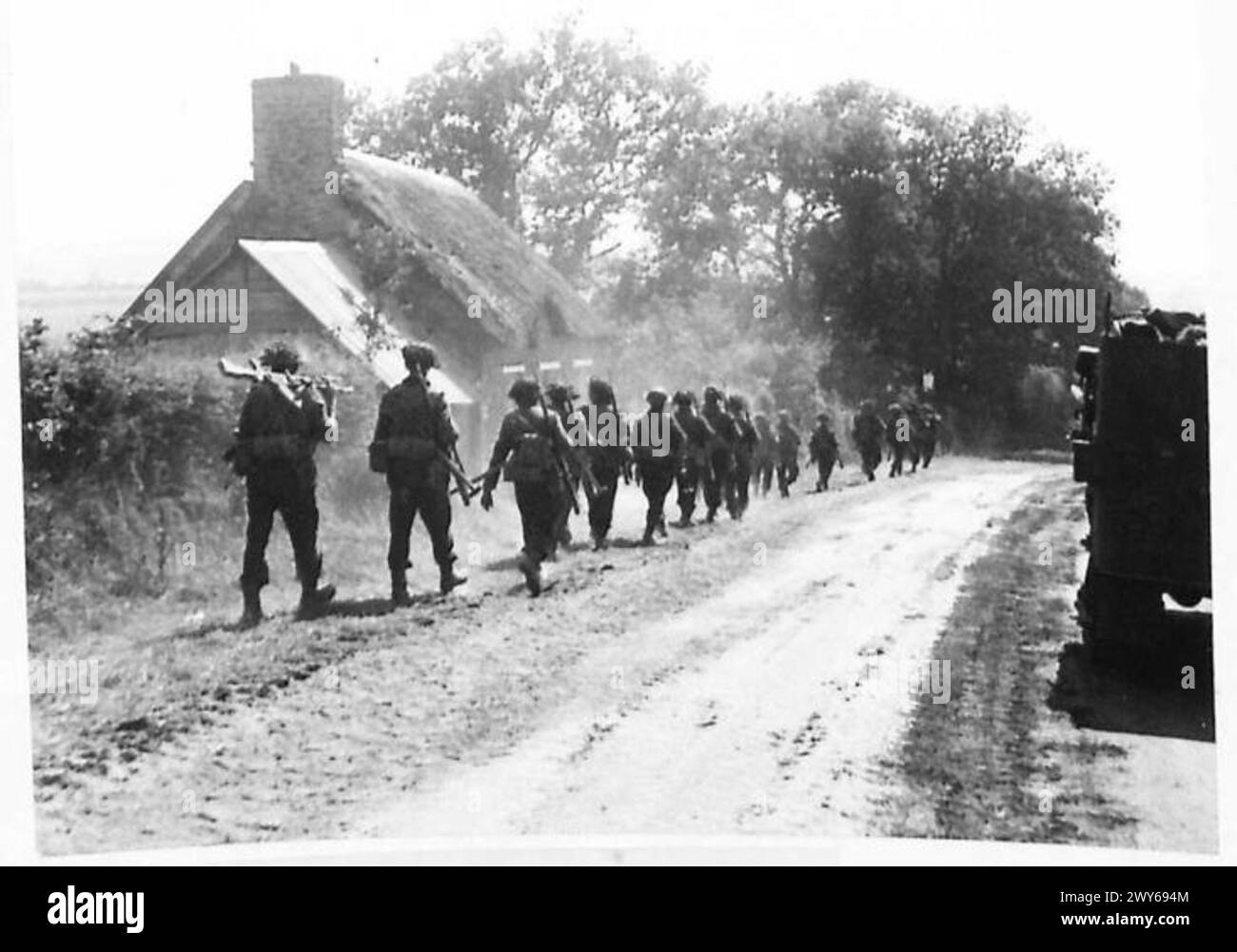 British infantry and tanks advance along the main road in Vassy ...