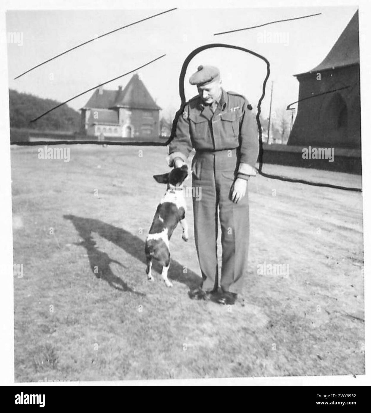 Lieutenant-General Ritchie is pictured with his adopted dog Shert ...