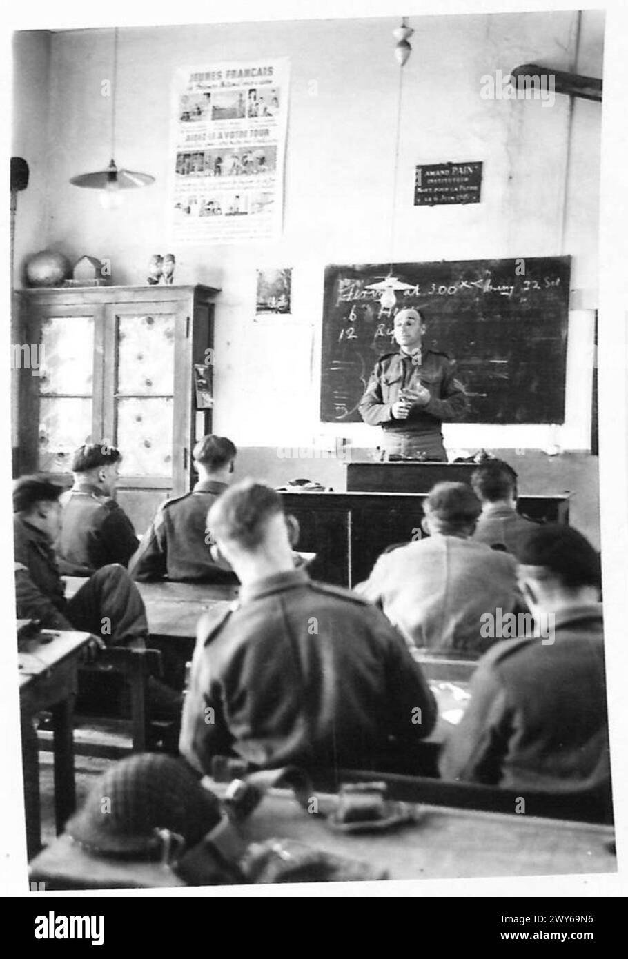 SCHOOL FOR SNIPERS - The tiny schoolroom of a Normandy village is used ...