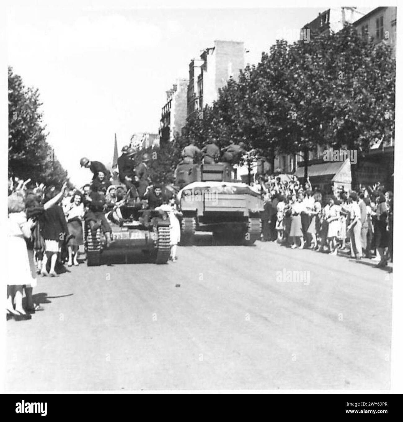 Residents of Paris line the streets to greet British, American ...