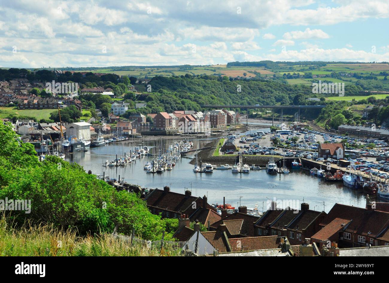 The town and busy working and leisure harbour at Whitby on the estuary ...