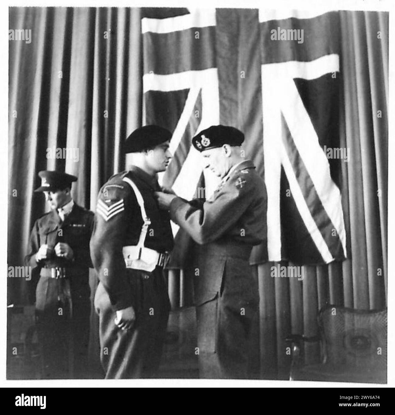 Sergeant L.E. Whitehouse of the 53rd Reconnaissance Regiment receives ...
