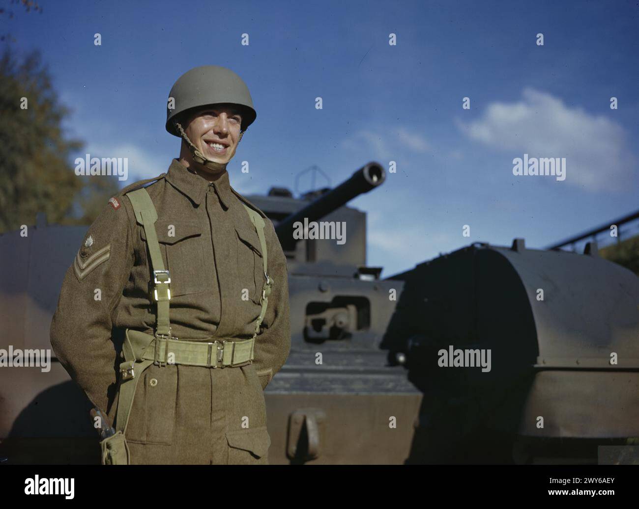 A corporal of the Grenadier Guards with a Churchill tank at the Guards ...