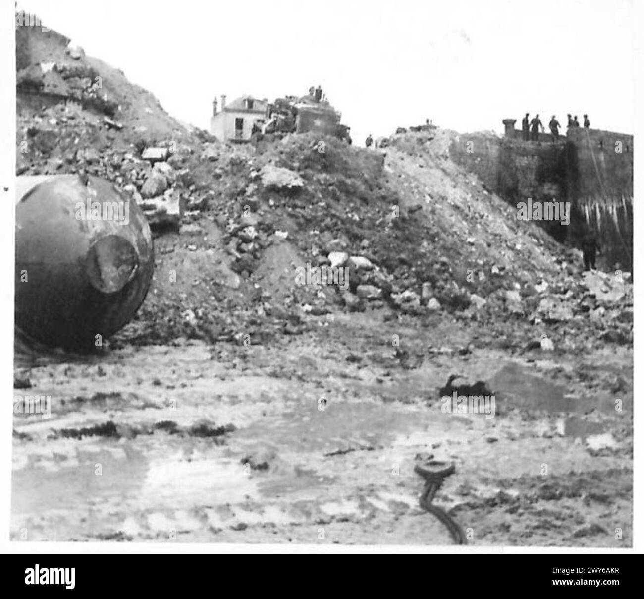 PHOTOGRAPHS OF PREFABRICATED PORT ETC - Bulldozer at work on demolished ...