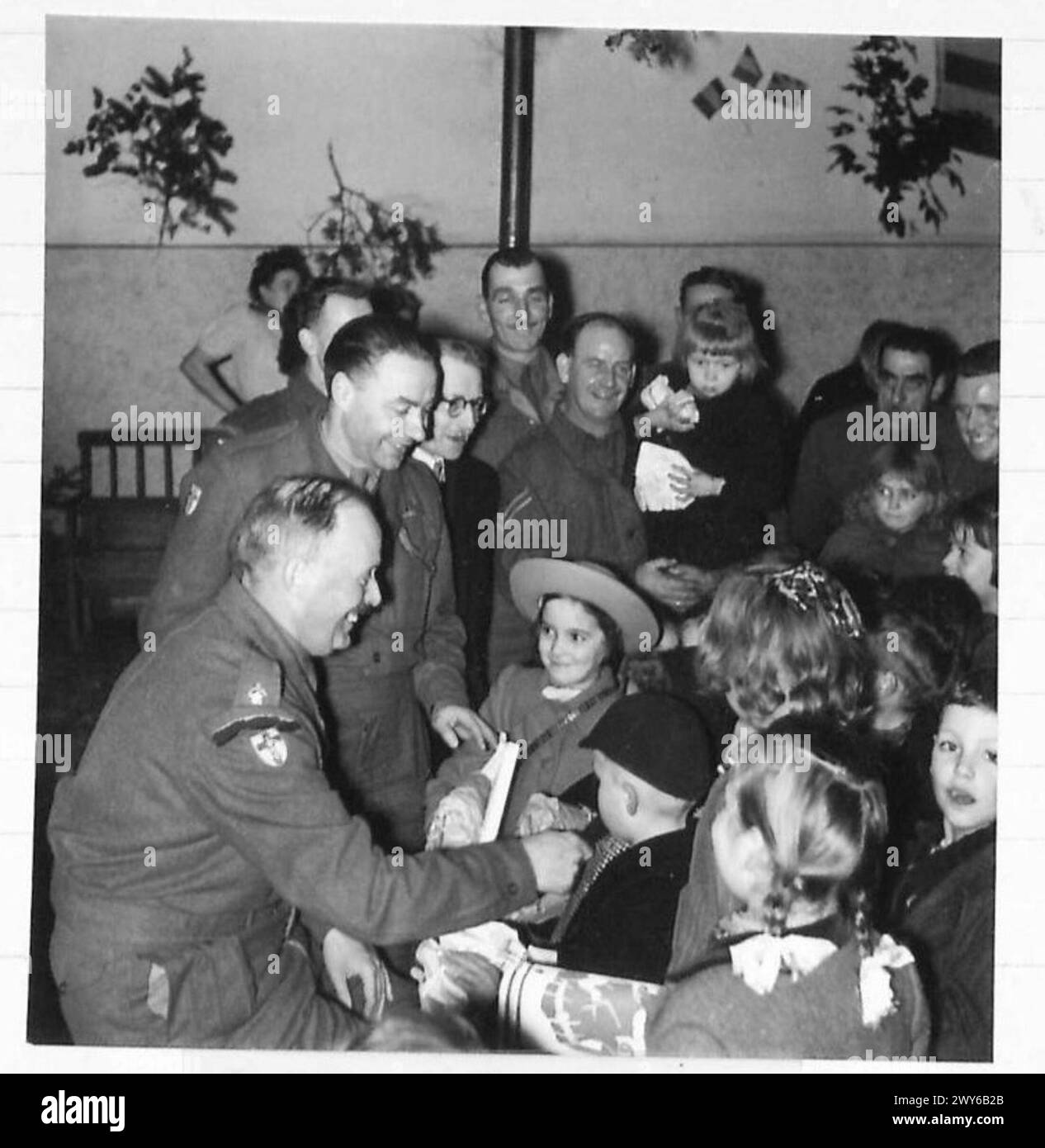 Major Turner, Camp Commandant of 2nd Army, interacts with children at a ...