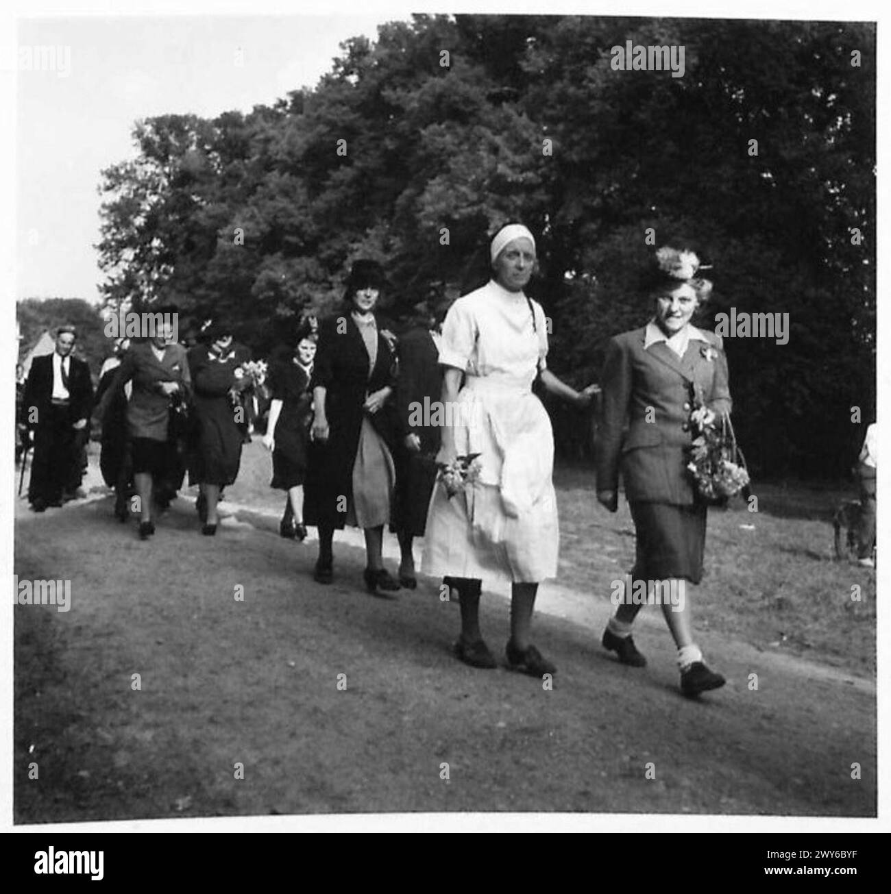 Members of the French Resistance (FFI) lead a procession through ...