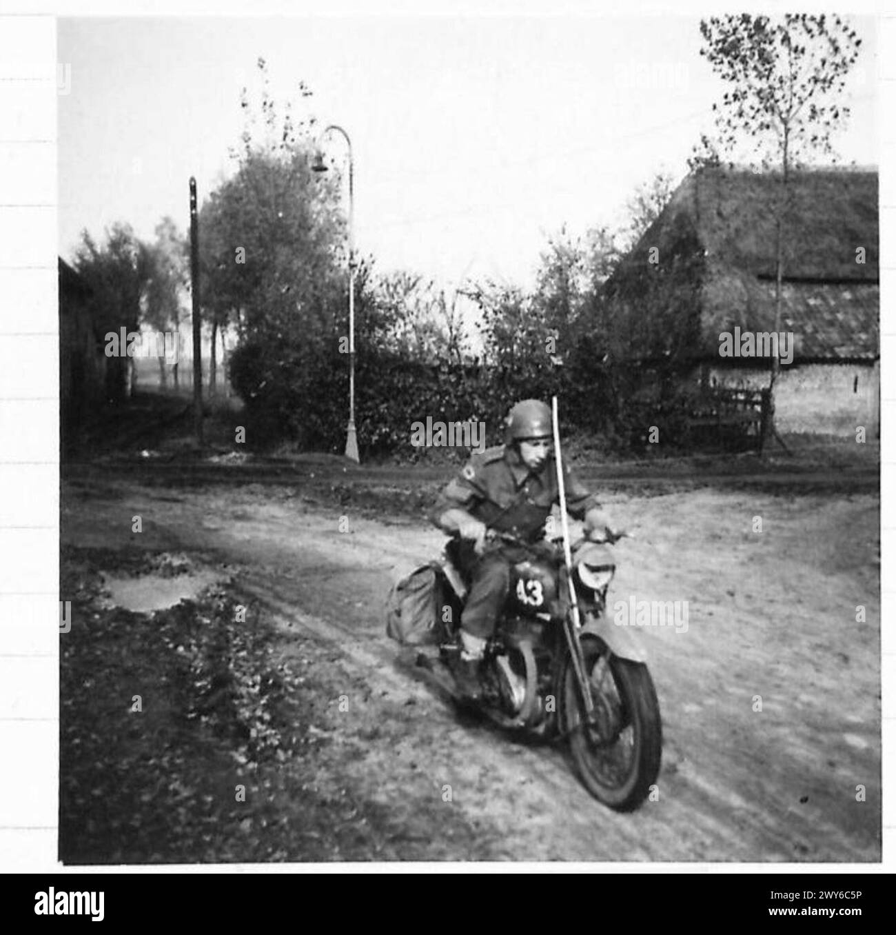 ENEMY BOOBY TRAPS. - Sgt. Wilson of the CMP passing harmlessly through ...