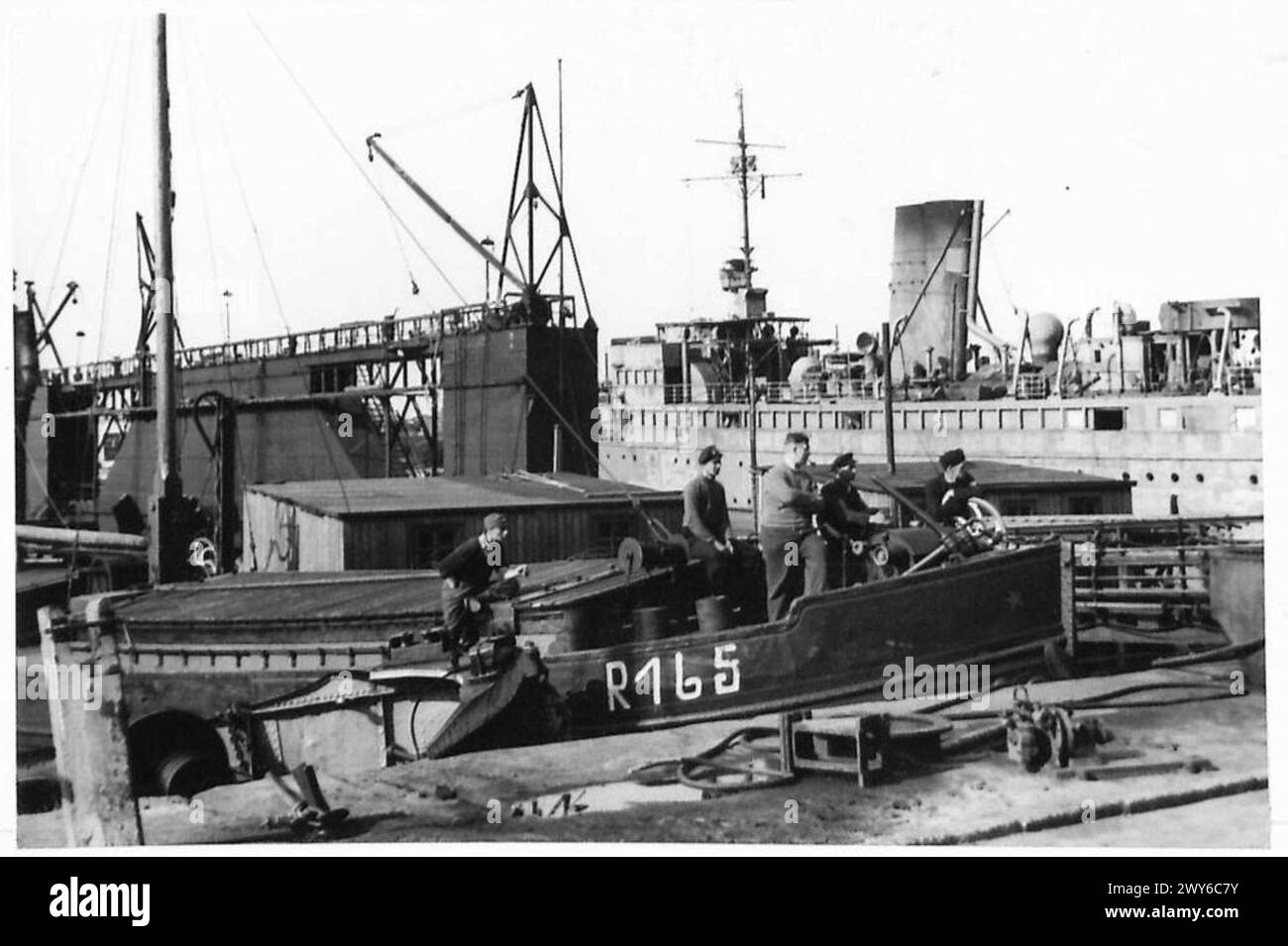 OCCUPATION OF BREMERHAVEN - The crew of a German barge watch British ...