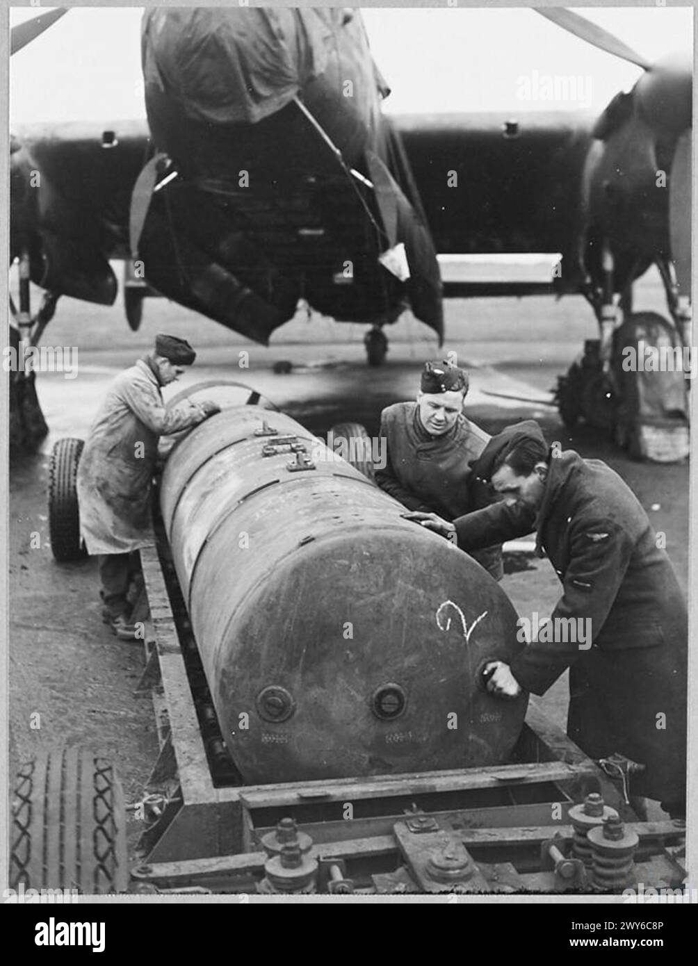 A 12,000-pound bomb is being prepared for loading into a Lancaster ...
