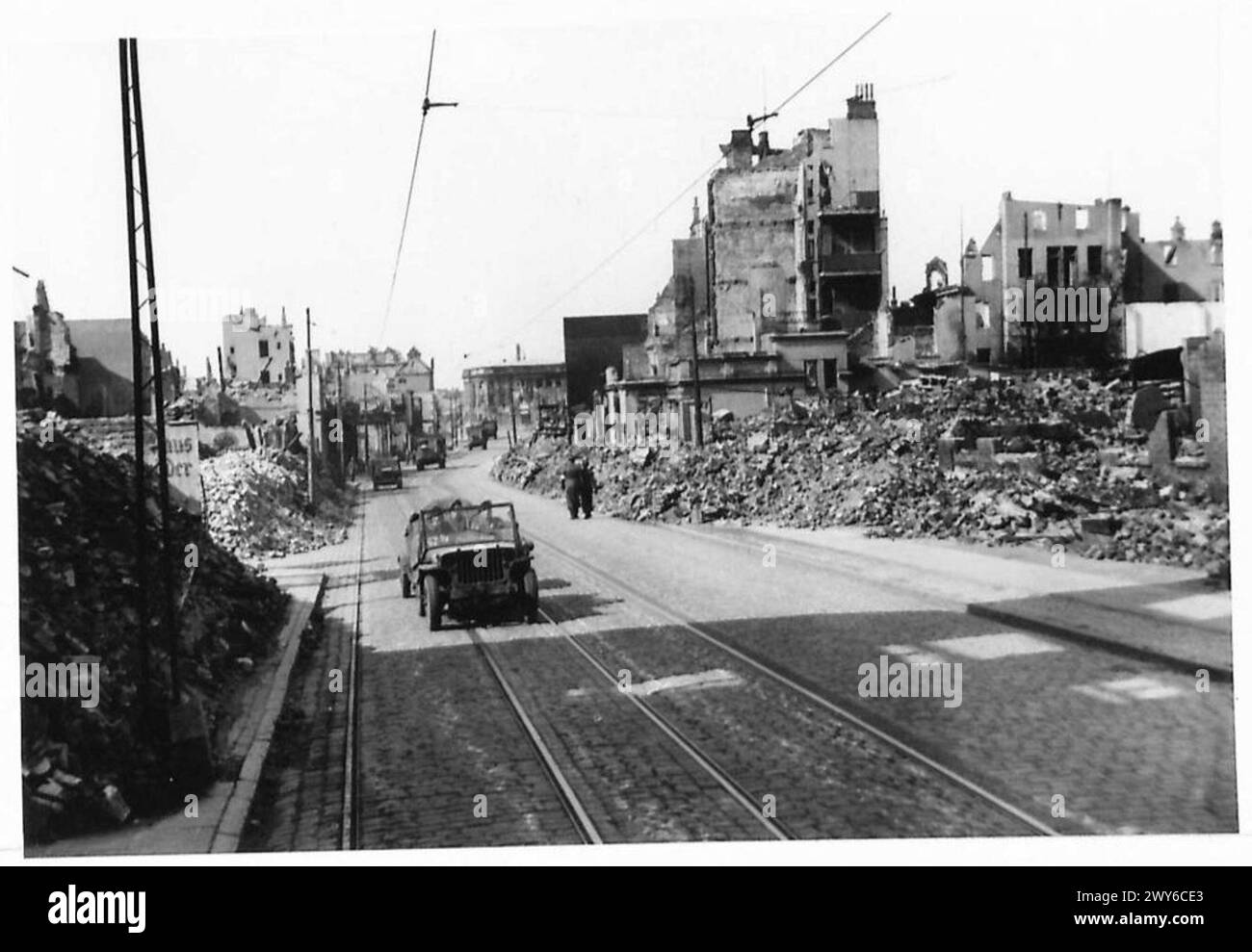 British Army vehicles pass through Wesermunde during the occupation of ...