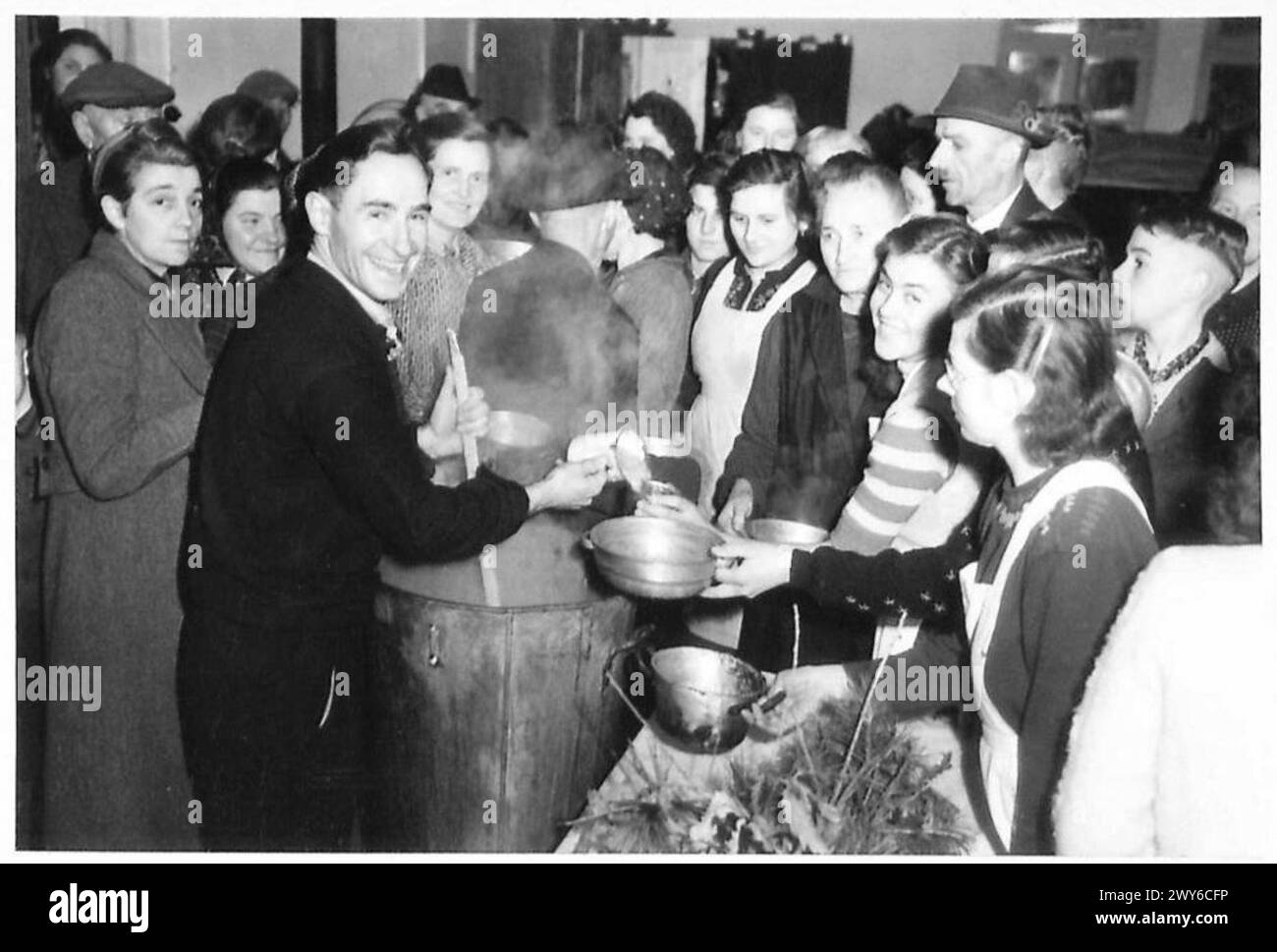 During civilian evacuation in British-occupied Germany, Germans receive ...