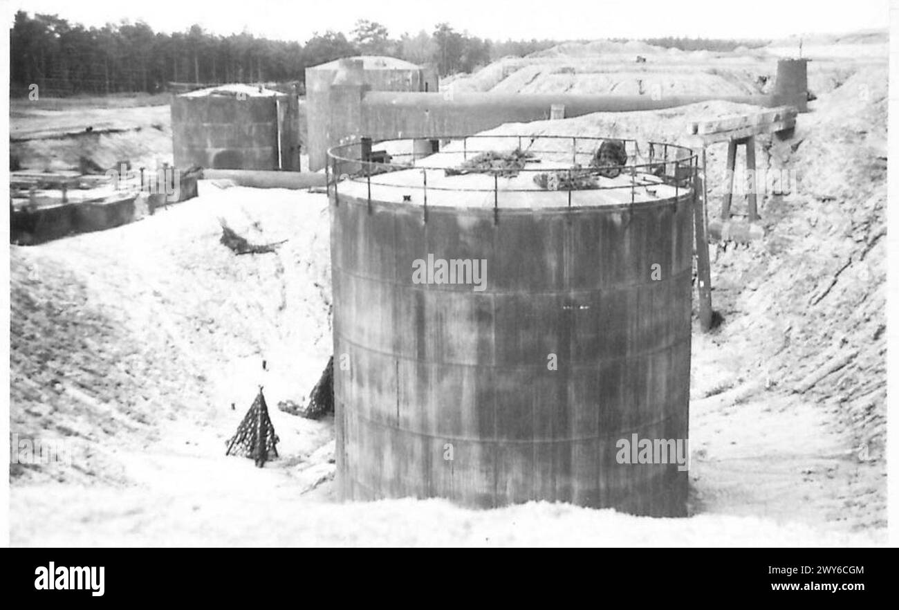CAPTURED GERMAN OIL REFINERY - Large storage tanks in the artificial ...