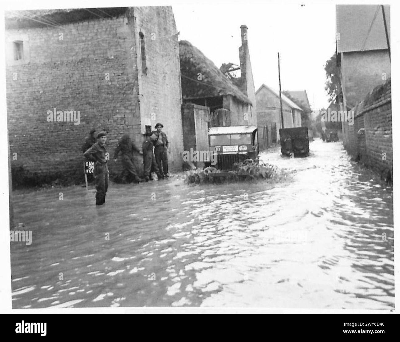 FLOODED ROADS IN NORMANDY - A Jeep ploughing its way through the floods ...