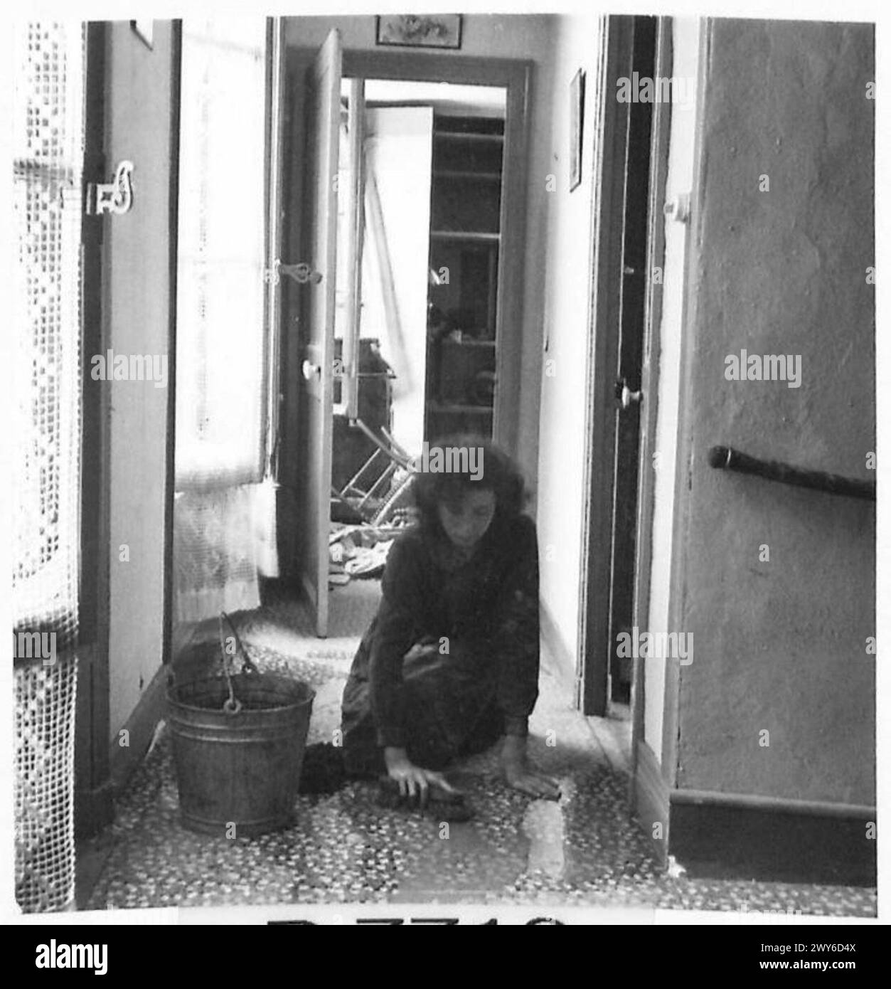 A French family returned to their shell-damaged village, cleaning and ...