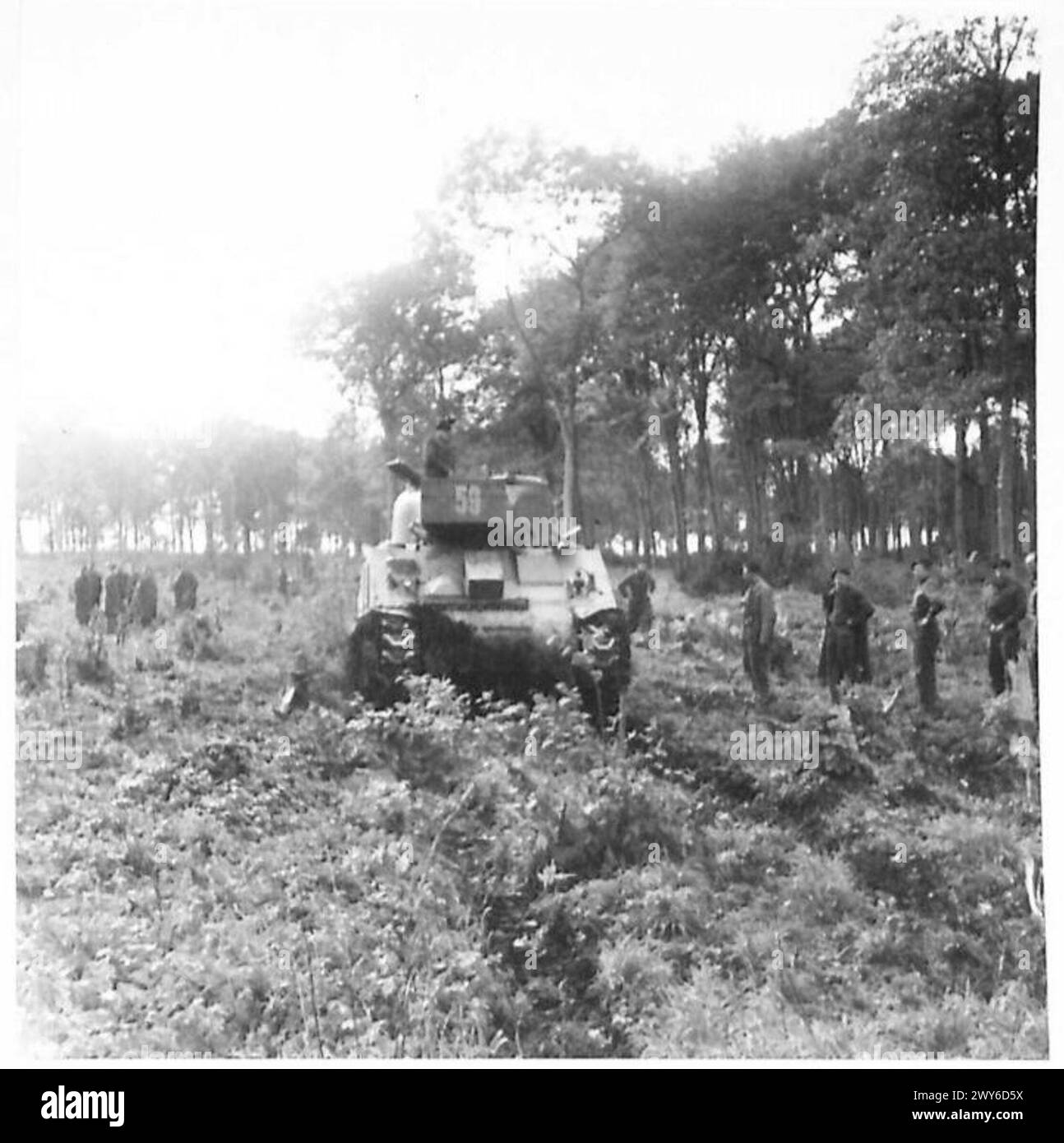 TANK TRIALS - One of the competing Shermans watched by armoured ...
