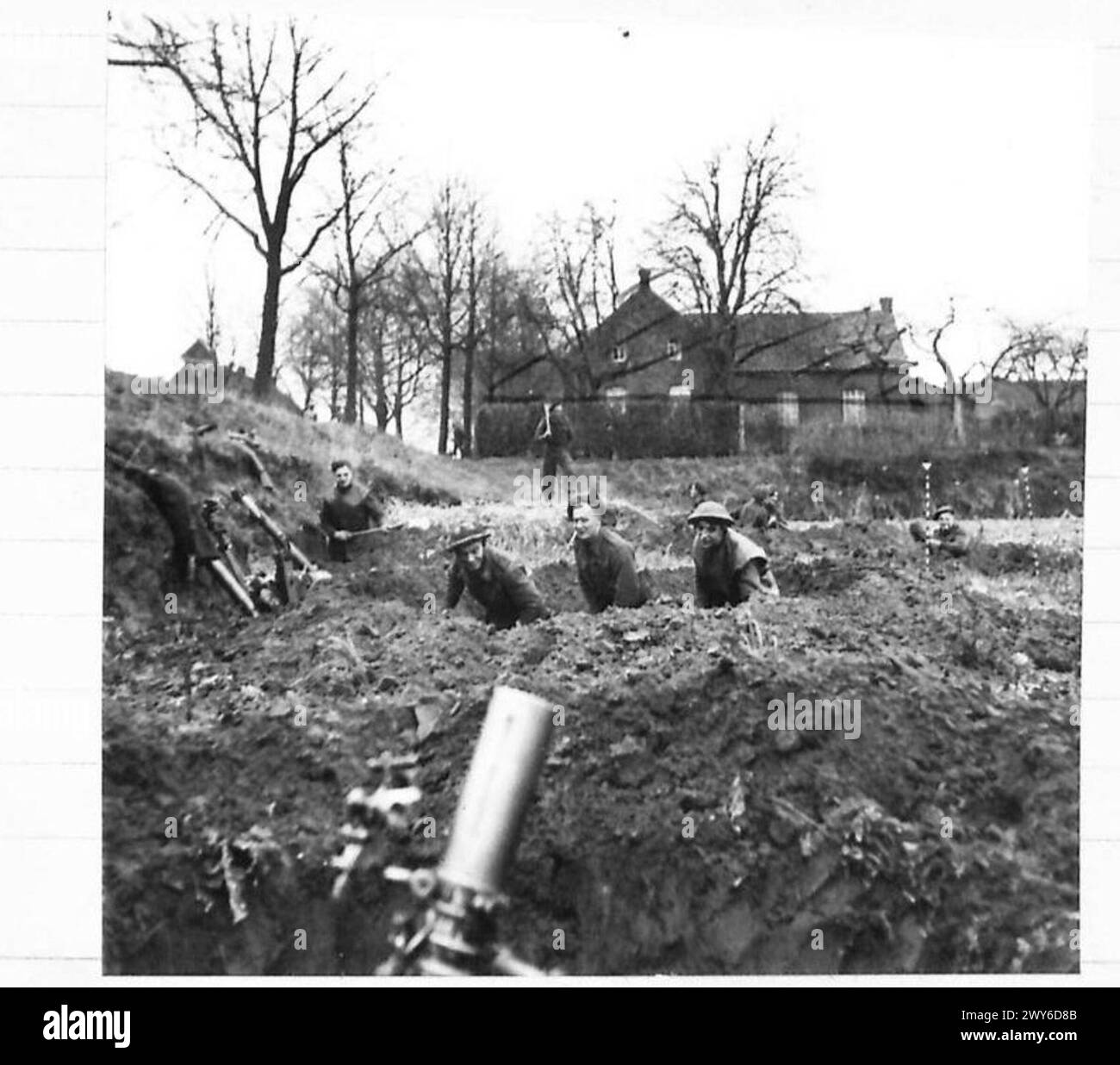 A mortar platoon of the Welsh Regiment is digging defensive positions ...