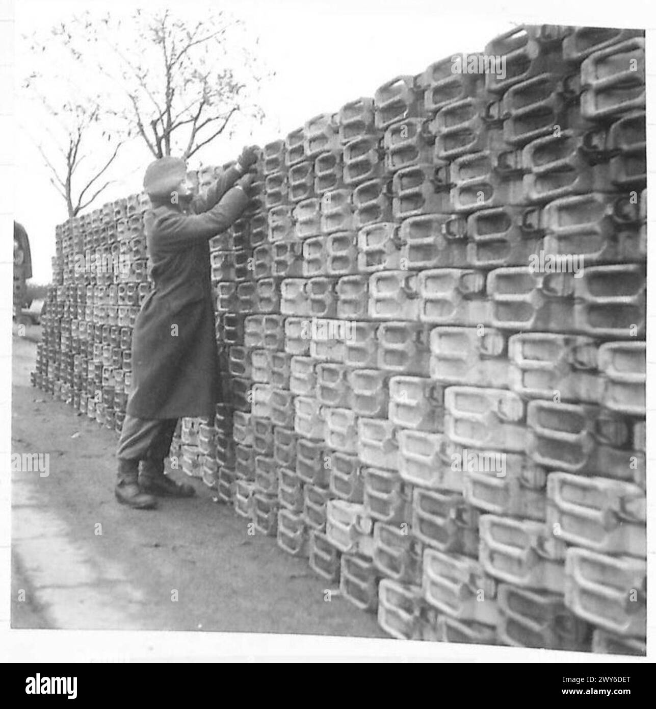 2nd ARMY ROADHEAD - A stack of 'jerry' cans containing petrol awaiting ...