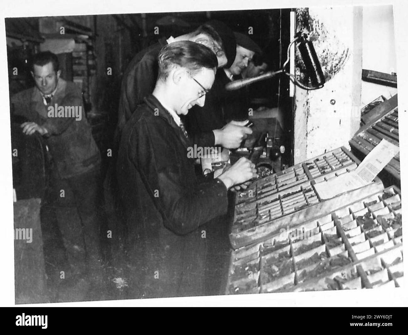 PRINTING FREE NEWSPAPER - Compositor at work. , British Army, 21st Army ...