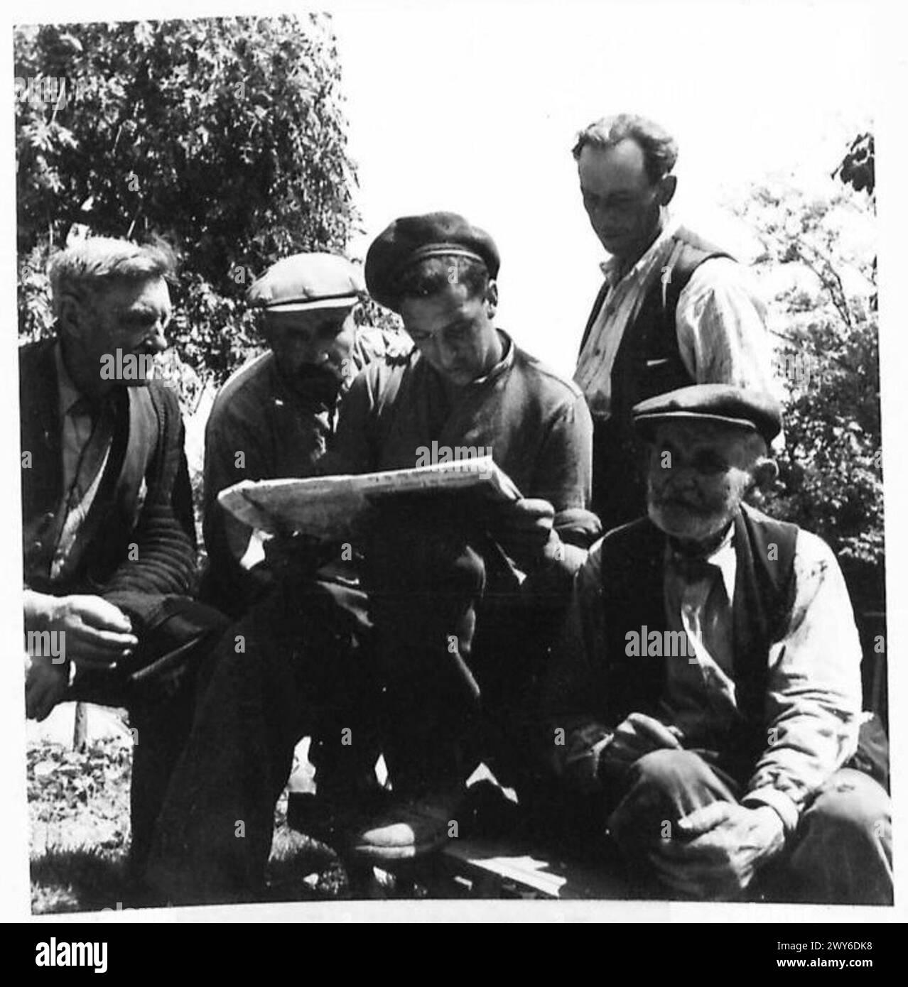A FRENCH FAMILY RETURN TO THEIR SHELL TORN VILLAGE - A Canadian sapper ...