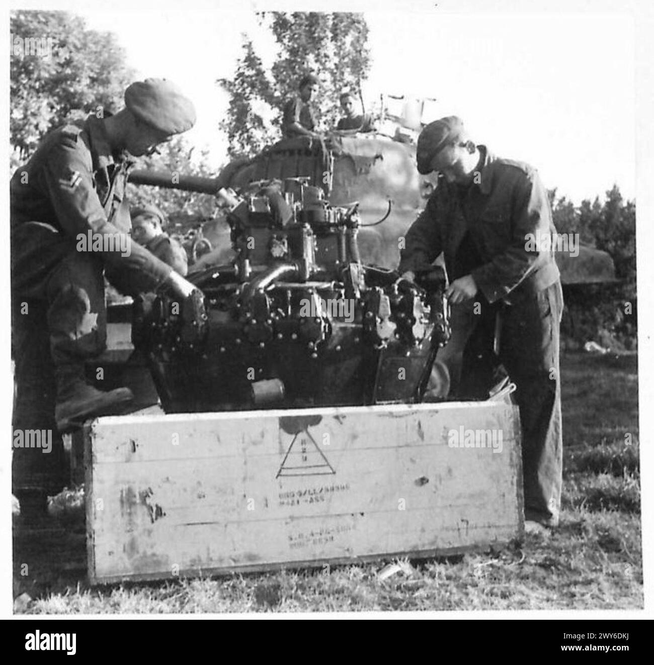 REME craftsmen repair a tank engine in a workshop situated close behind ...