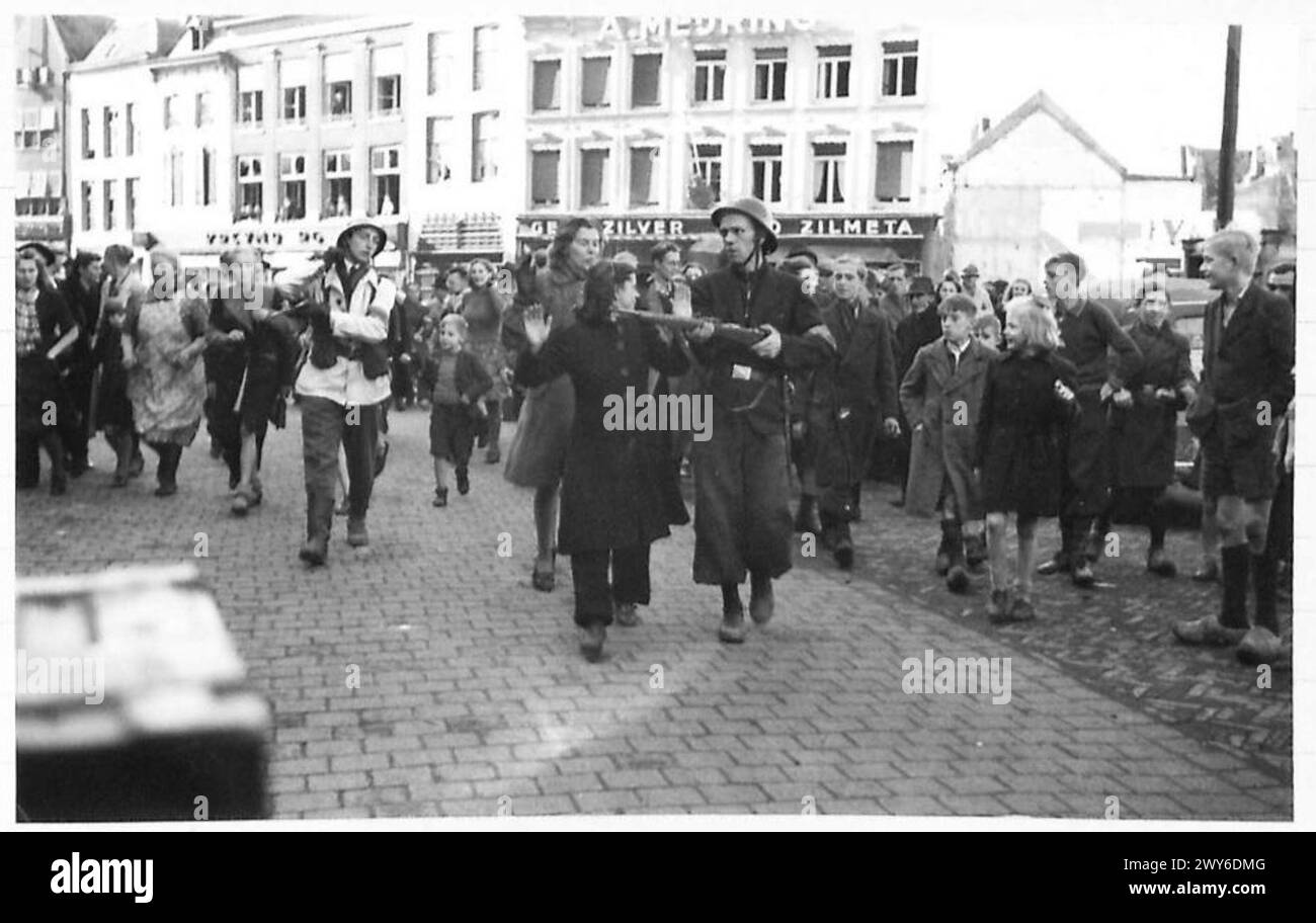 Young women identified as collaborators are escorted through the ...