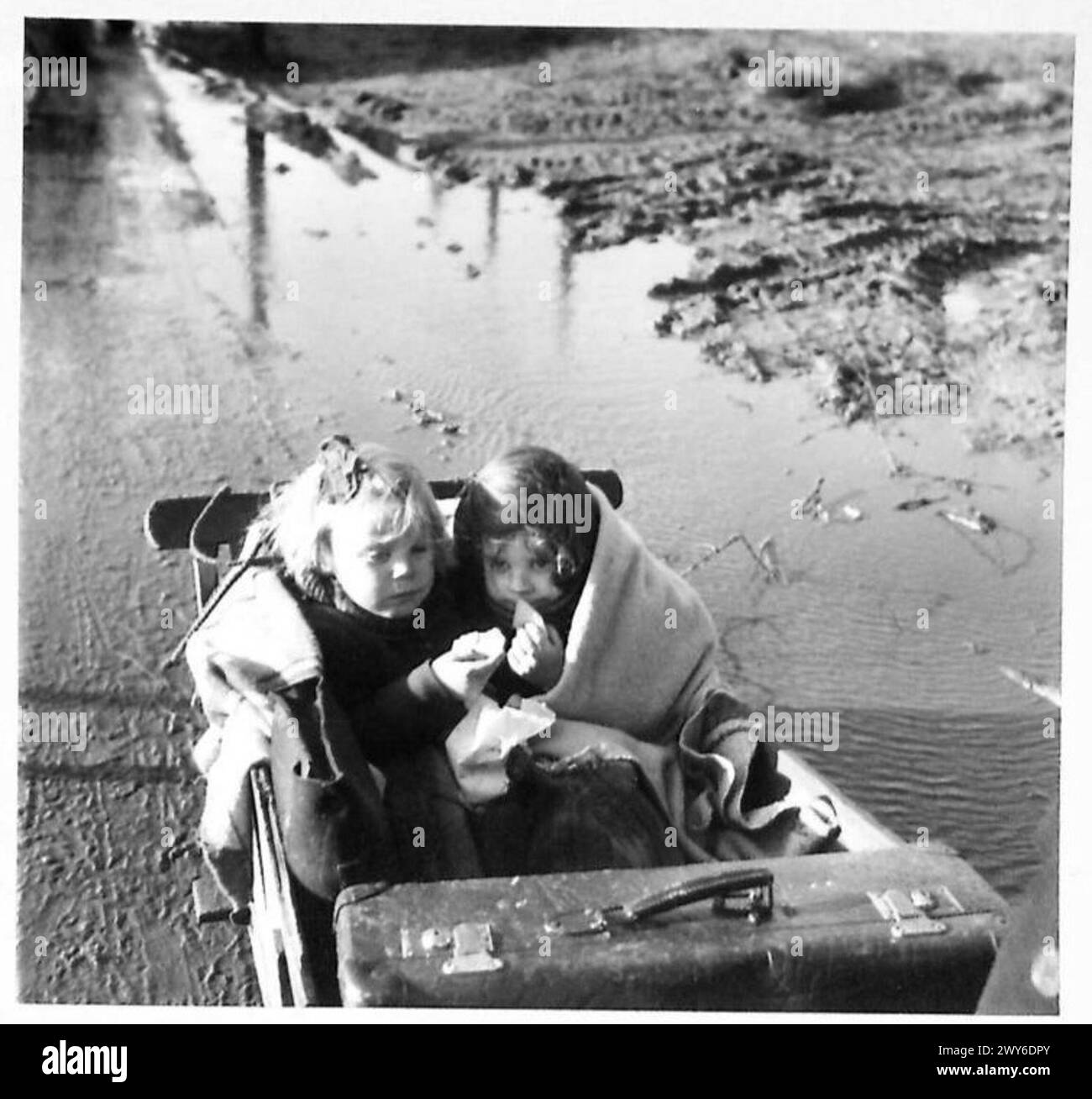 Two children, evacuated during the British 15th Scottish Division ...