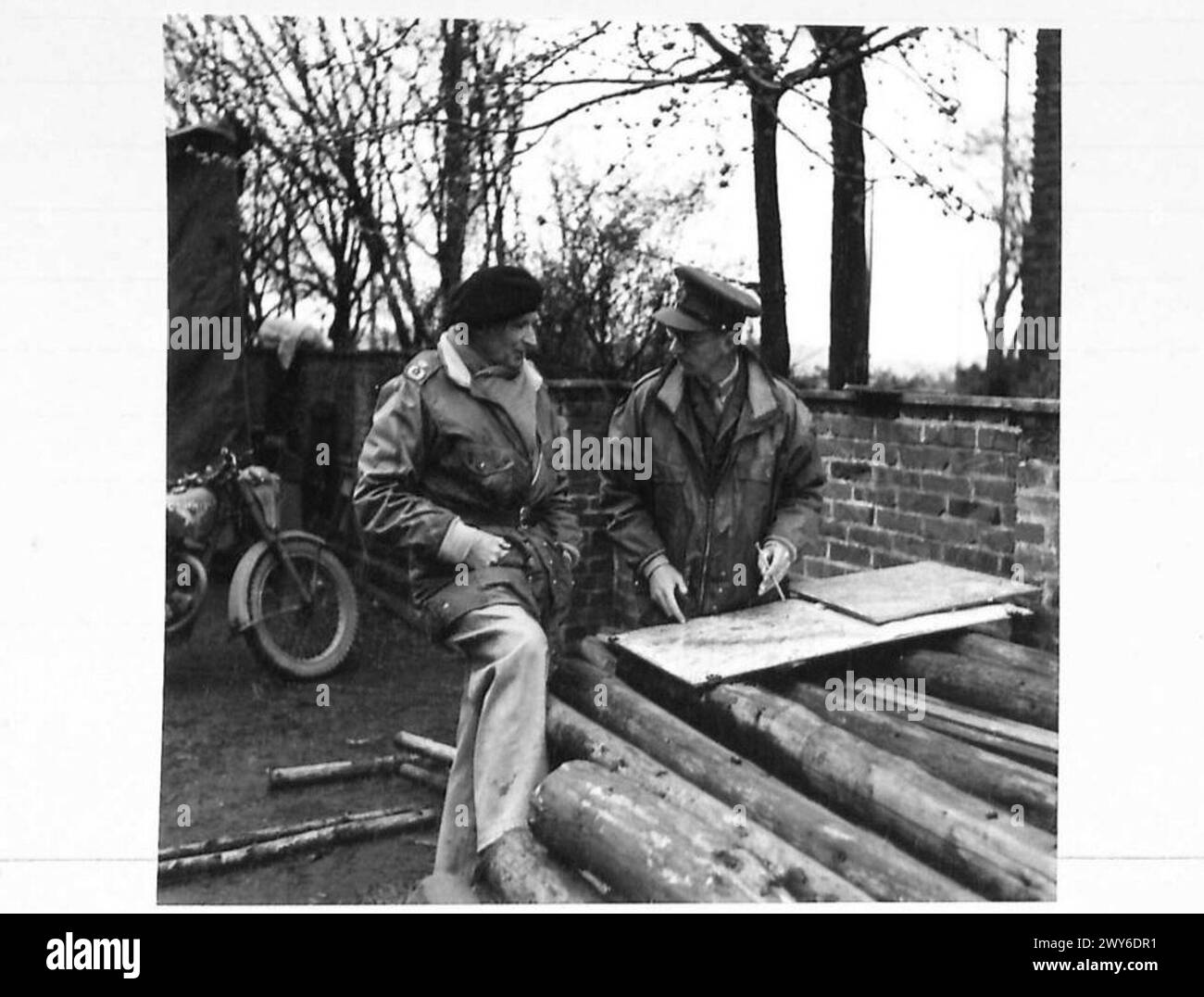 Field Marshal Montgomery and Lieutenant General Dempsey examine maps on ...