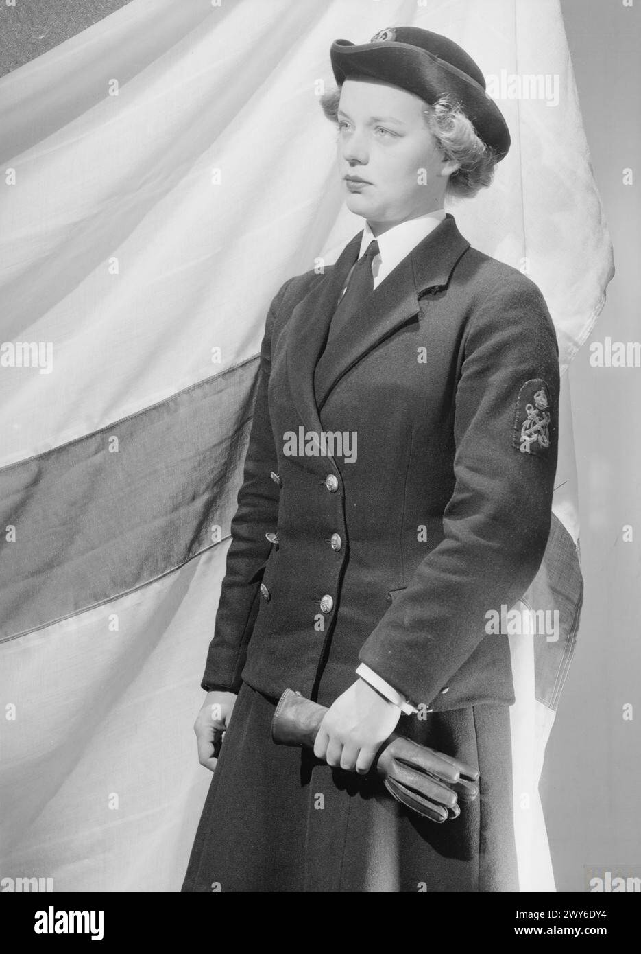 WOMEN'S ROYAL NAVAL SERVICE. - A Petty Officer Wren, distinguished by ...