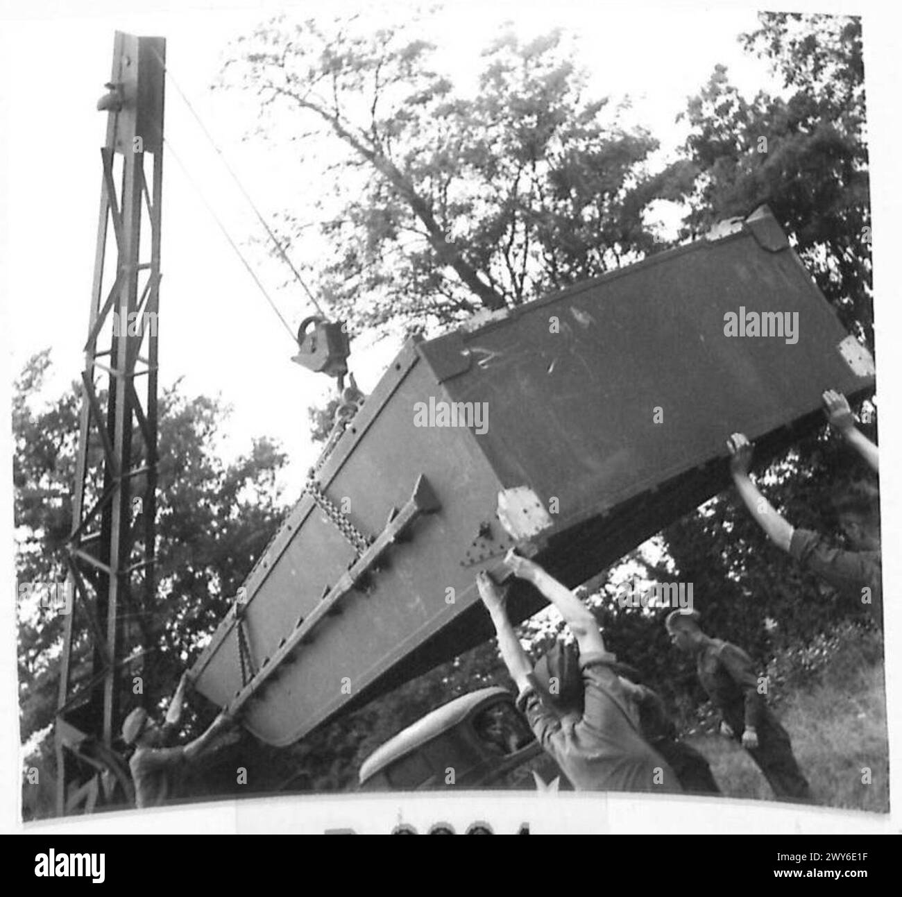 PONTOON BRIDGES FOR NORMANDY - A pontoon being swung into position in ...
