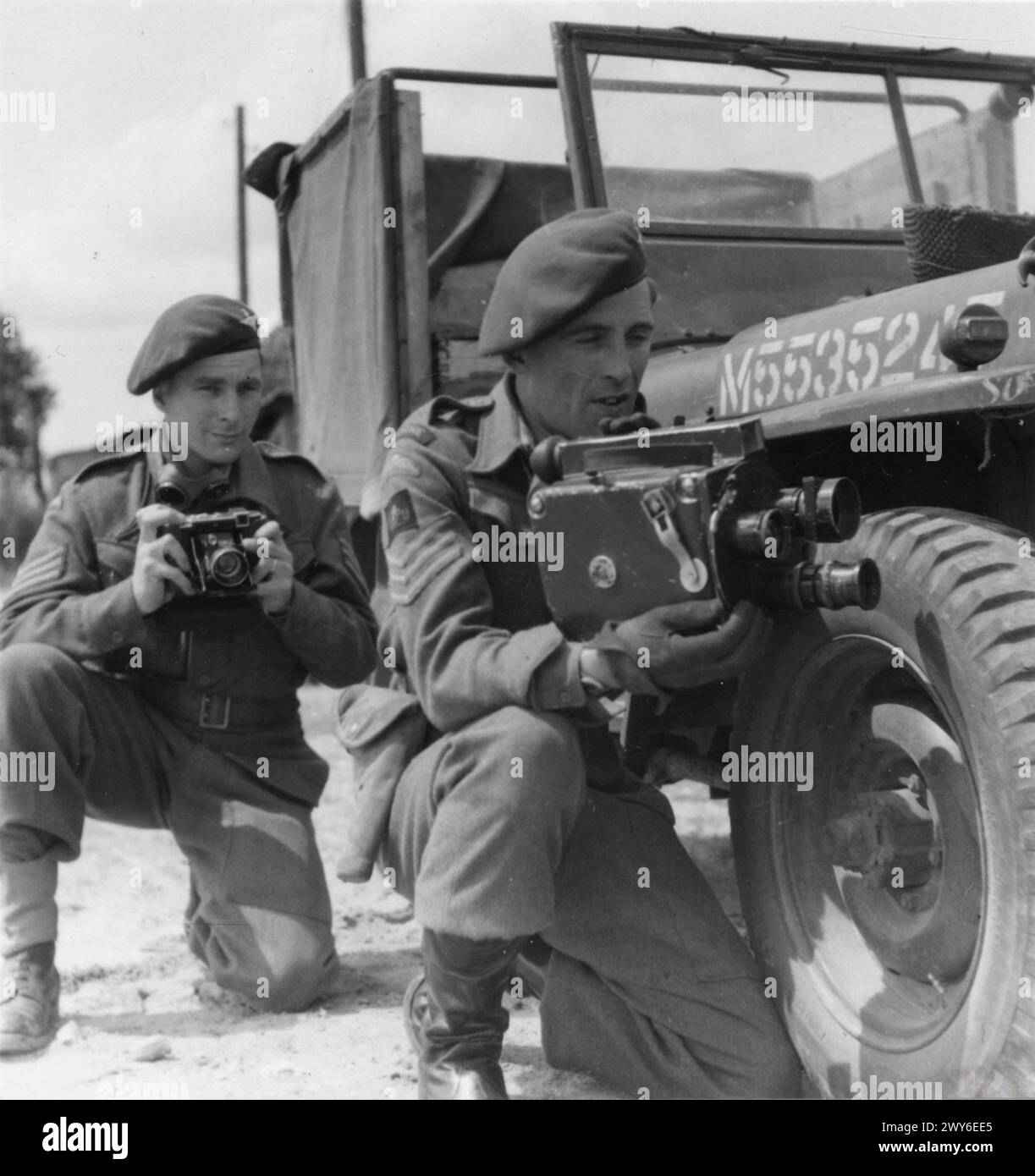 AFPU cameramen Sgt Harry Oakes and Sgt Bill Lawrie operate stills and ...