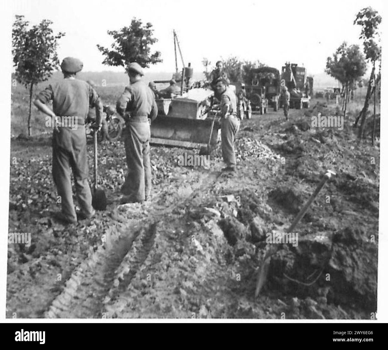 THE BRITISH ARMY IN NORTH-WEST EUROPE 1944-1946 - A bulldozer clearing ...
