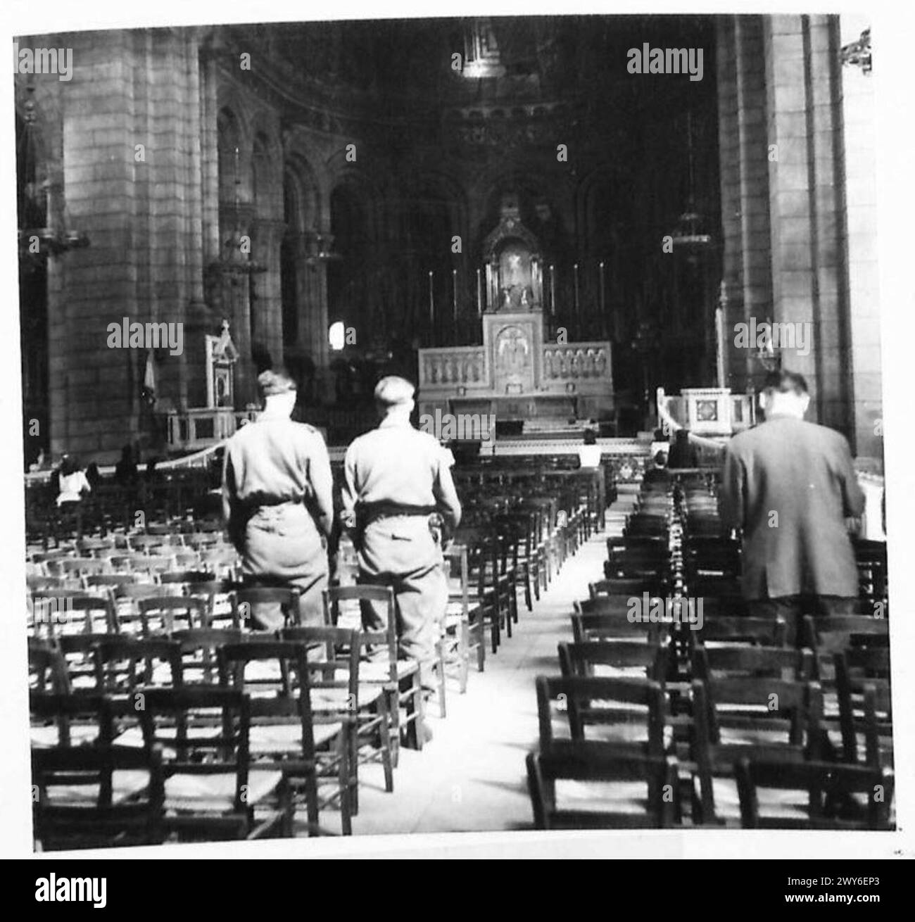 Two British Army soldiers of the 21st Army Group are attending a ...