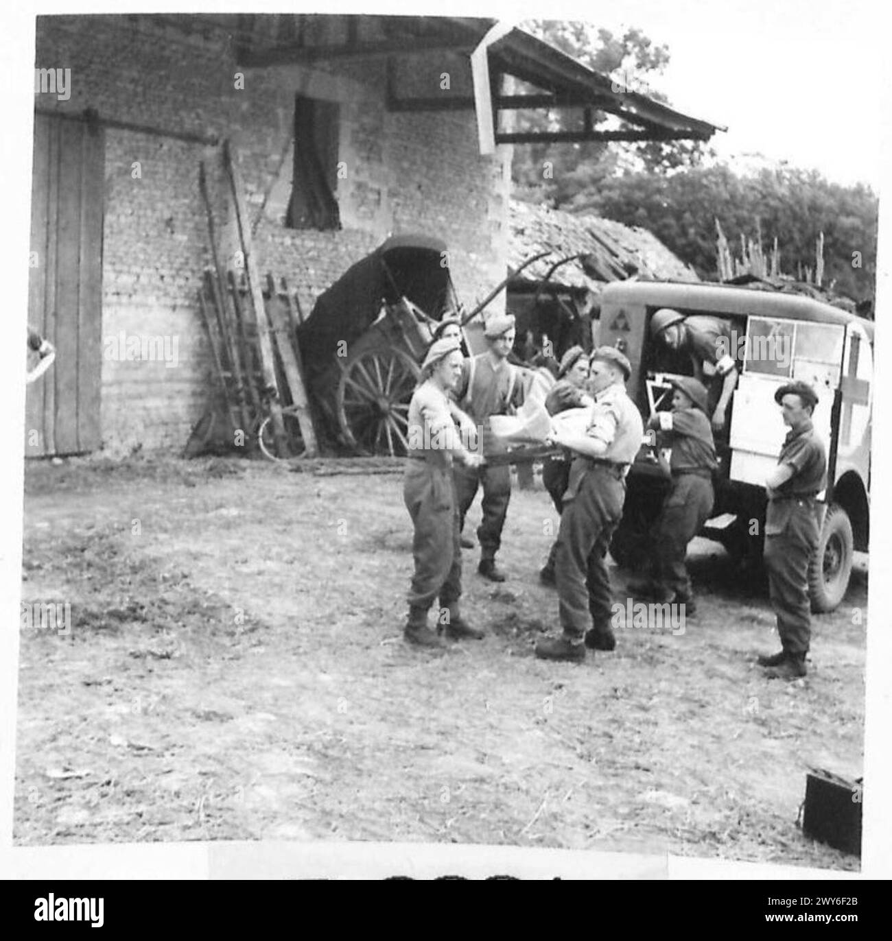 TREATMENT AND EVACUATION OF WOUNDED - The casualty being carried from ...