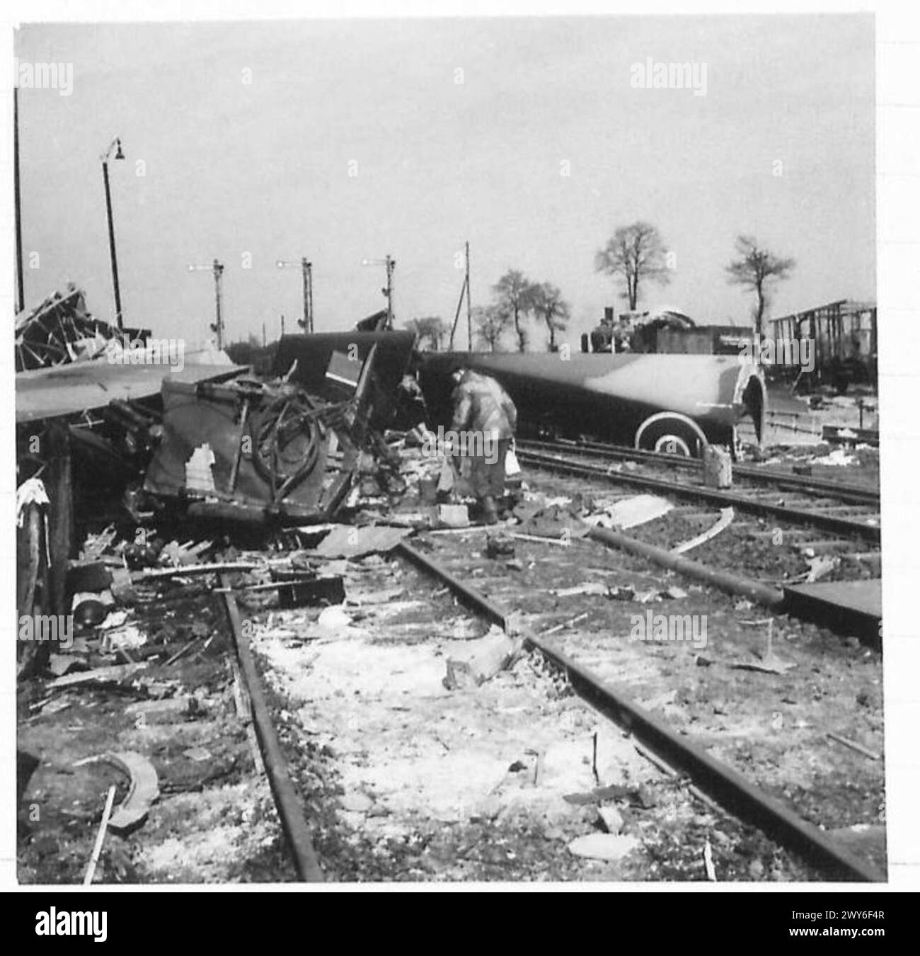 A wrecked glider and jeep at Hamminkeln railway station illustrate the ...