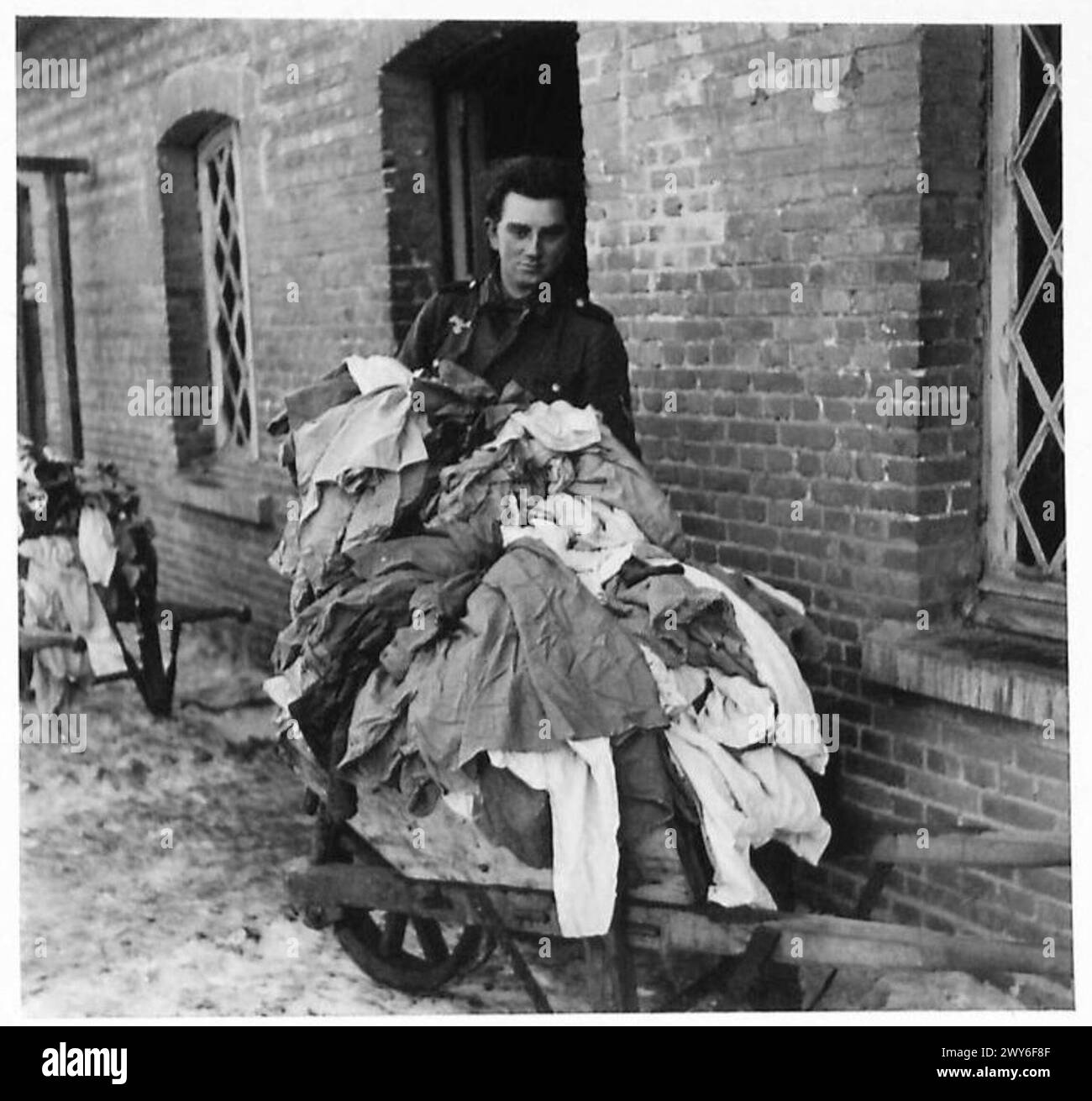 Wheelbarrow military Cut Out Stock Images & Pictures - Alamy
