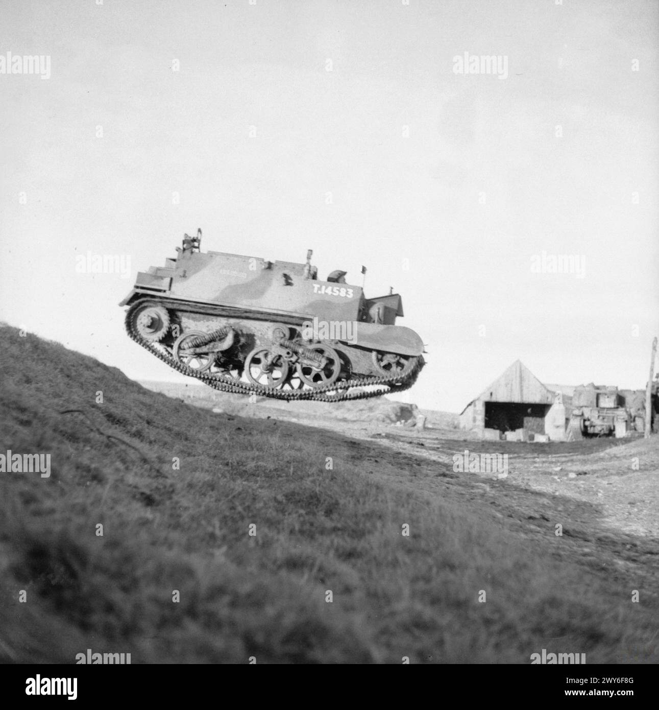 Universal carrier of the 52nd Reconnaissance Regiment moves at speed ...