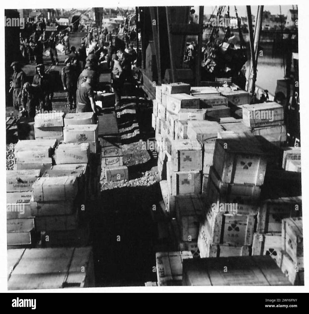 DIEPPE. - Unloaded boxes are sent along a mechanical roller track and ...