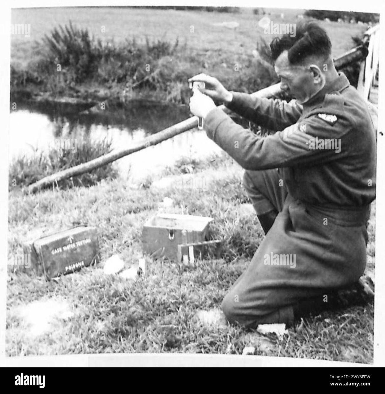 WITH 10 FIELD HYGIENE SECTION IN NORMANDY - S/Sergeant Howarth tests ...