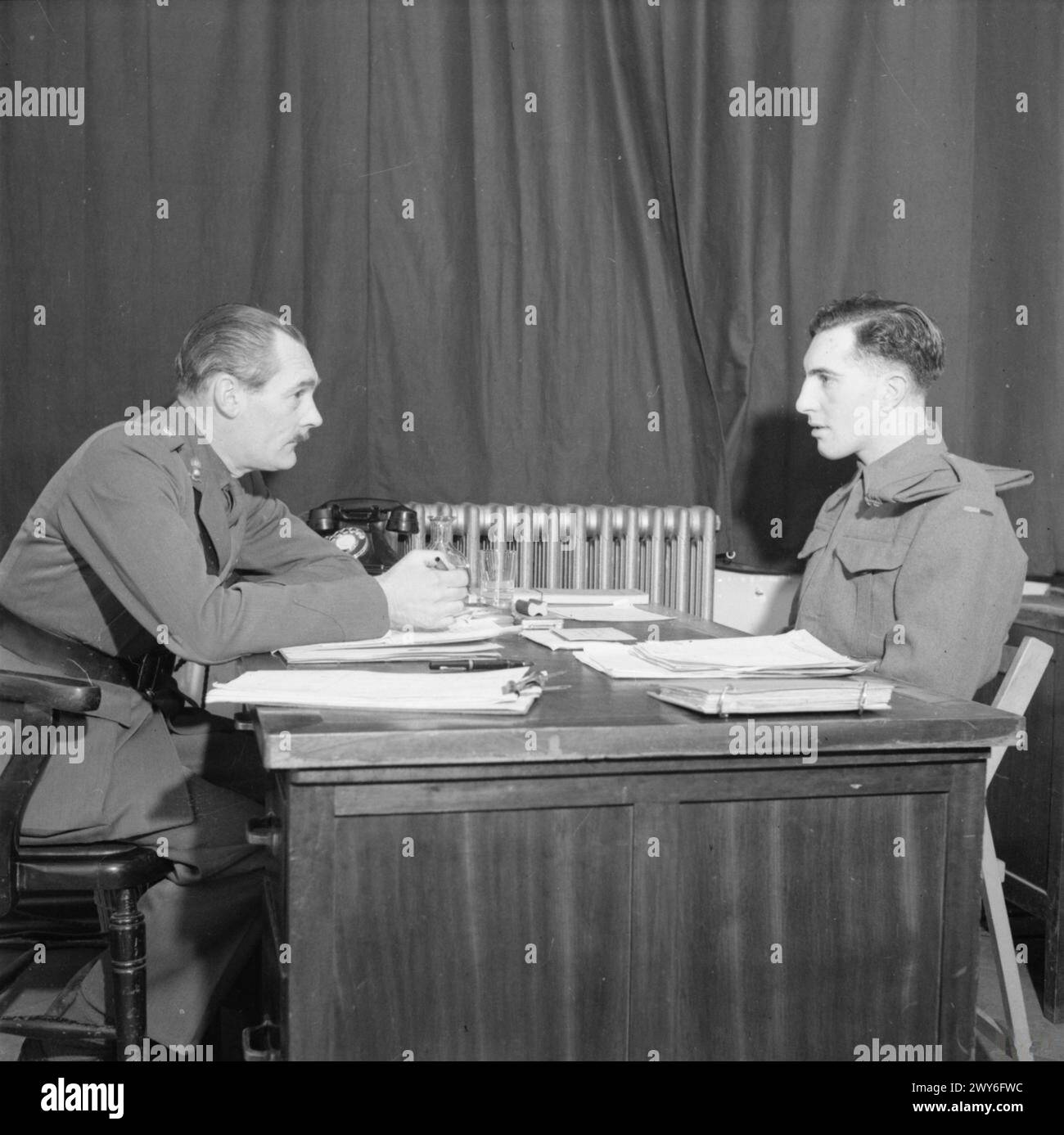 New recruit Bill Jones is interviewed by a British Army officer after ...
