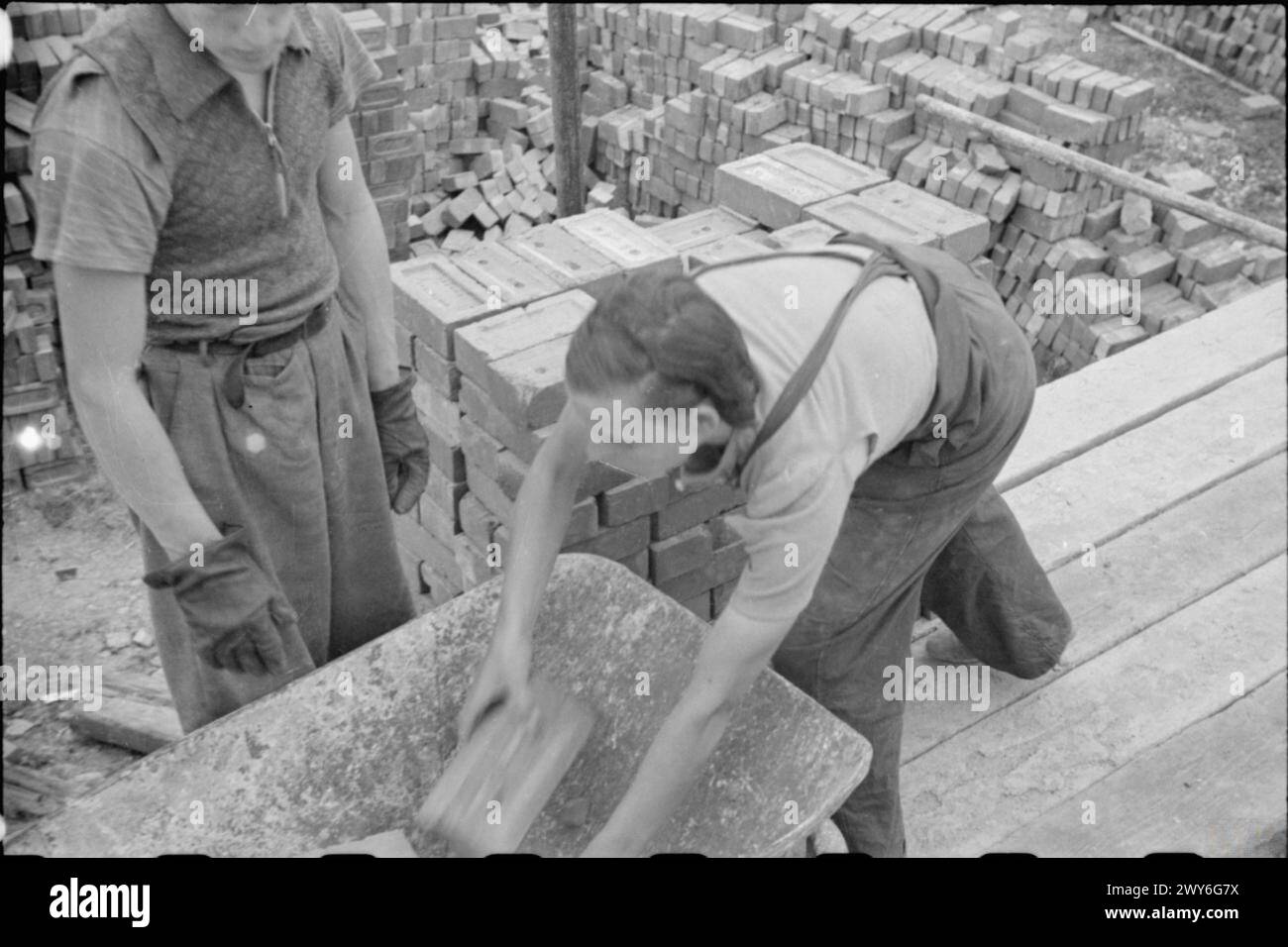 BRITISH GIRLS BUILD HOMES FOR MUNITION WORKERS, UK, 1941 - A female ...