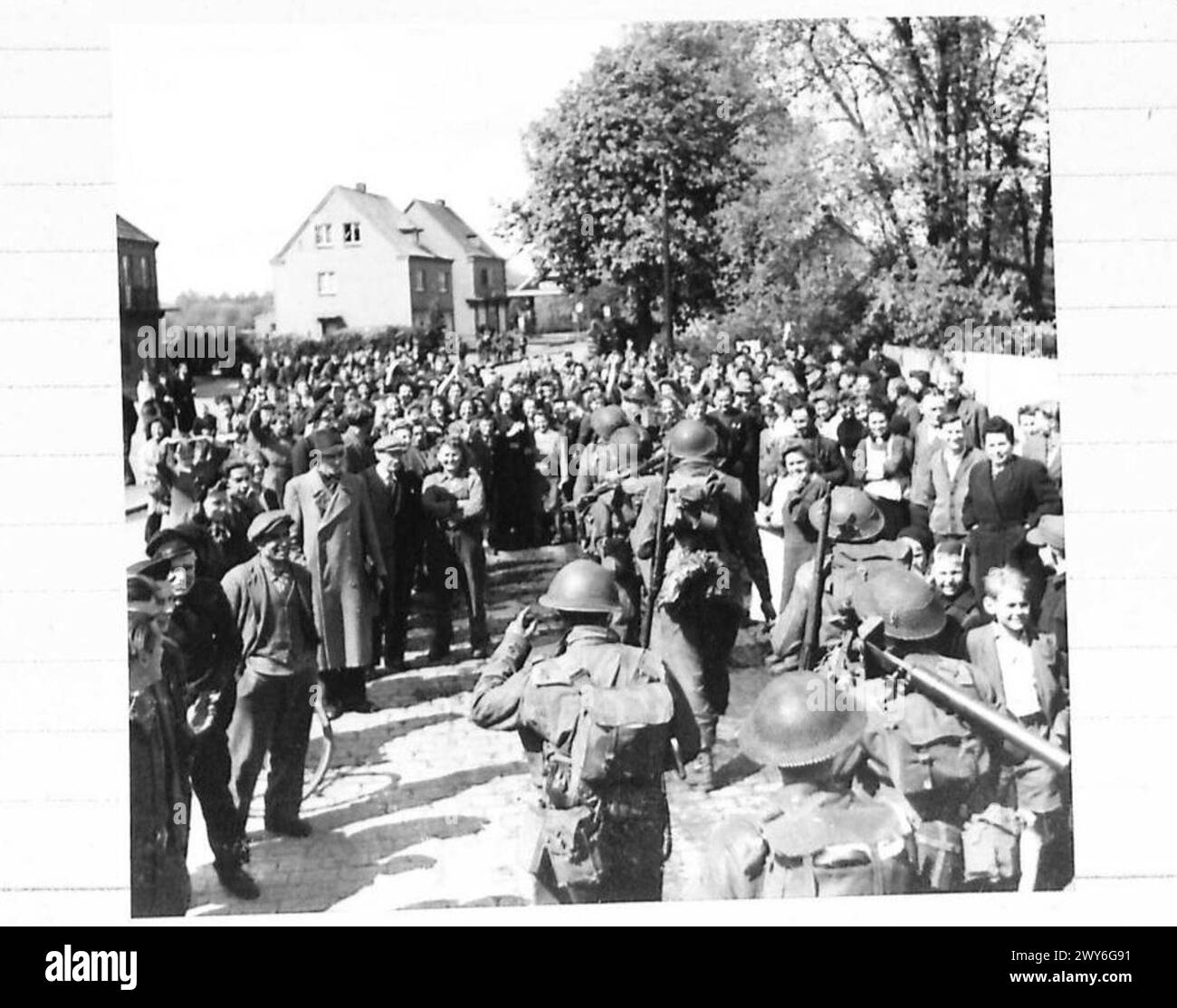 Residents of Geesthacht gather to welcome British troops arriving ...