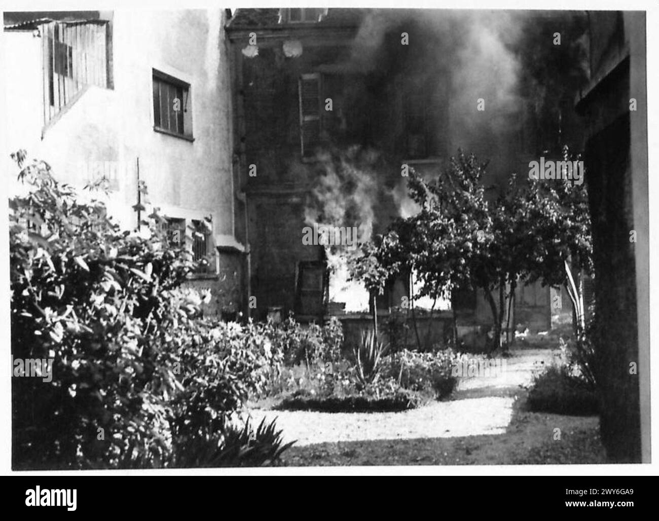 CROSSING THE RIVER SEINE - House set on fire by shell fire. , British ...
