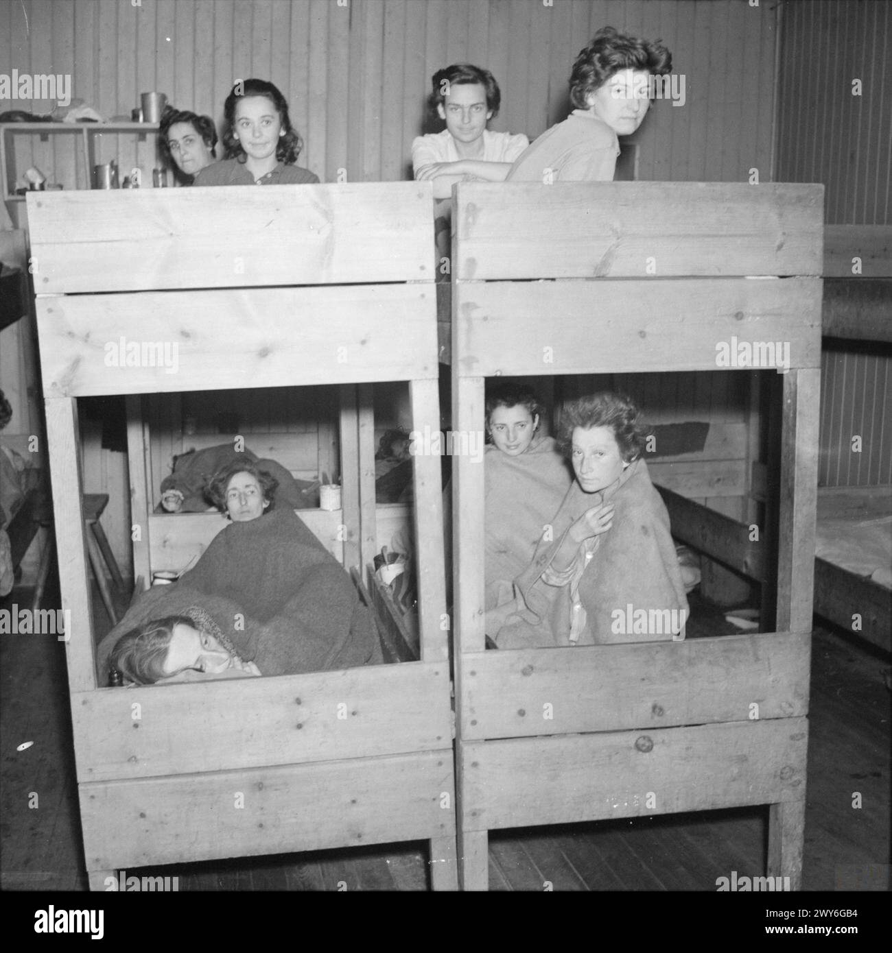 Inside Belsen camp, the typhus hospital is being cleaned and additional ...