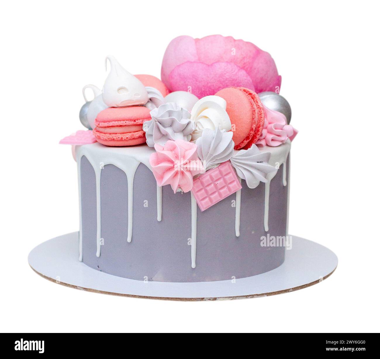 Tall pink cake decorated with macaroons, raspberries and flowers ...