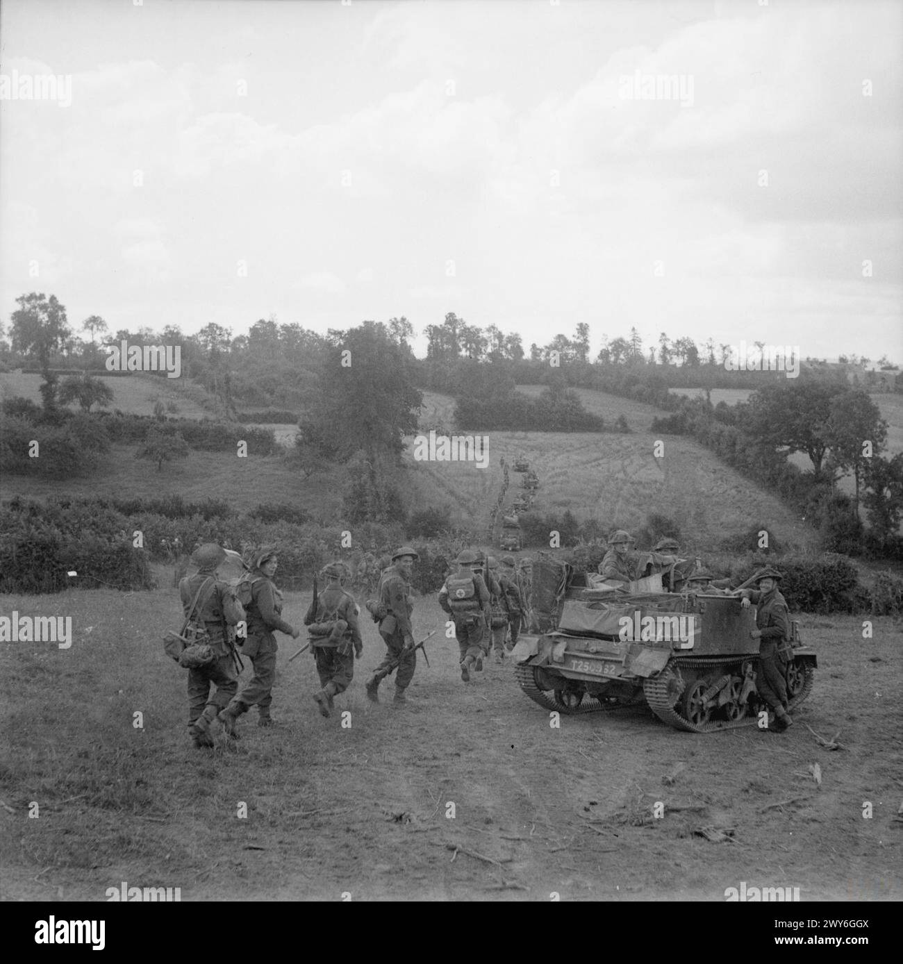 British infantry and armored units are advancing in formation during a ...