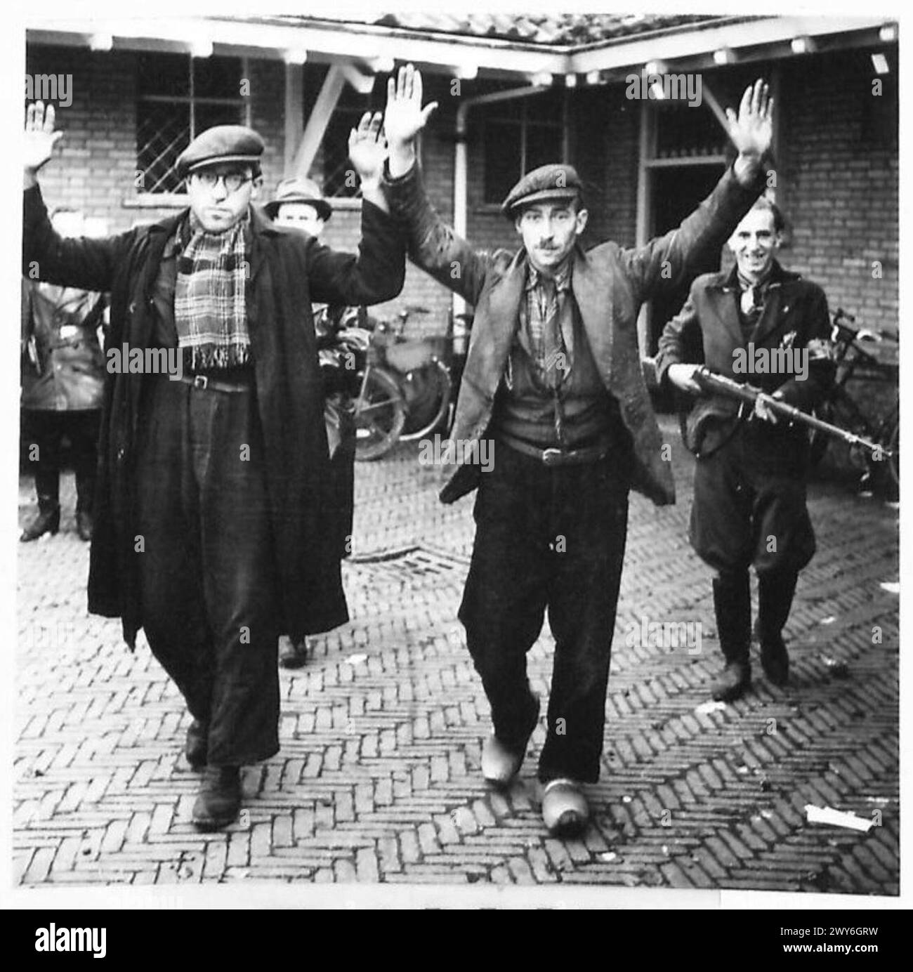 Two male collaborators are detained by members of the Free Forces of ...