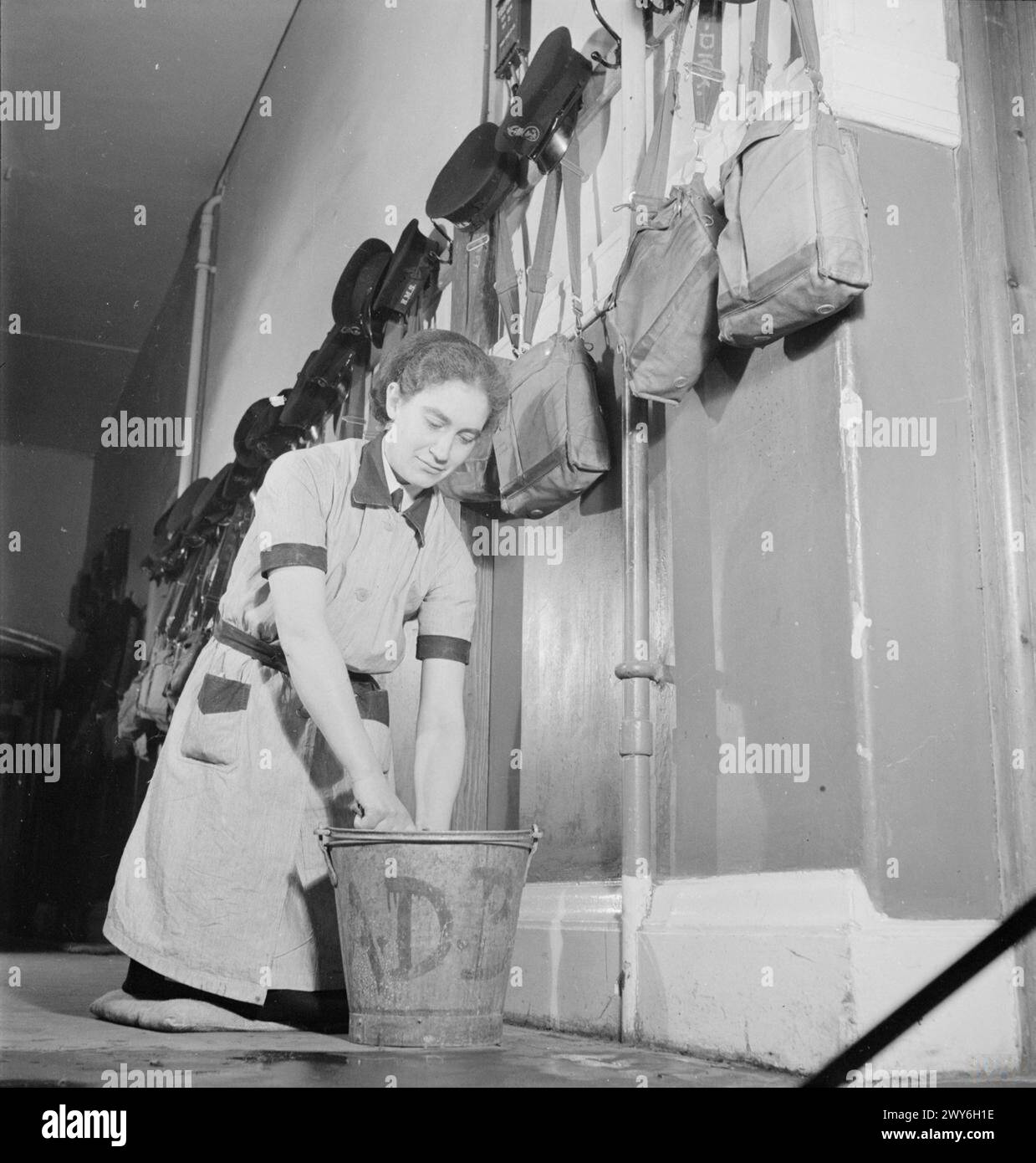 WOMEN'S ROYAL NAVAL SERVICE. - Wren stewards cleaning the floor Stock ...