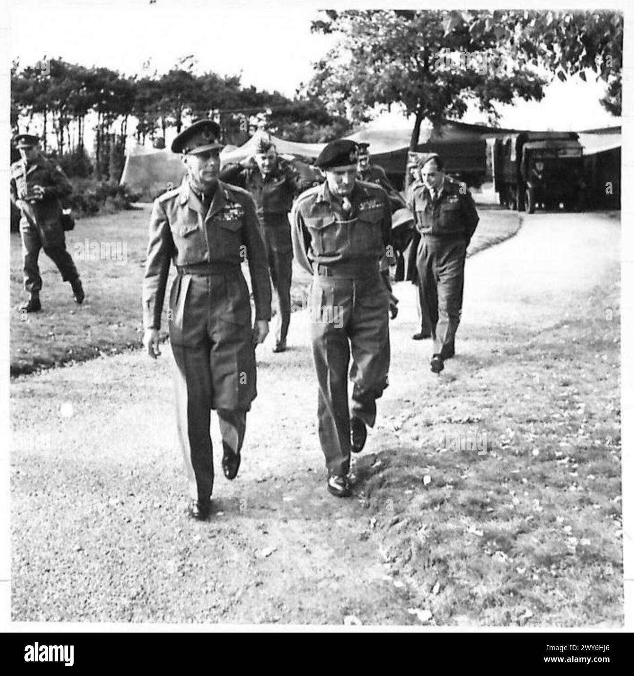 His Majesty the King, accompanied by Air-Marshal Conningham and Air ...