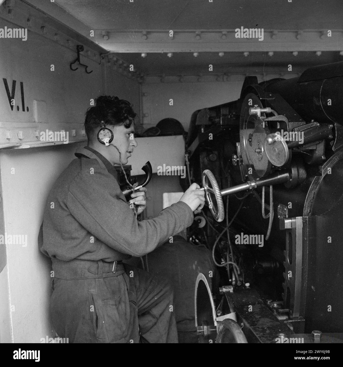 A sight setter at a British coastal battery sets ranges and deflections ...